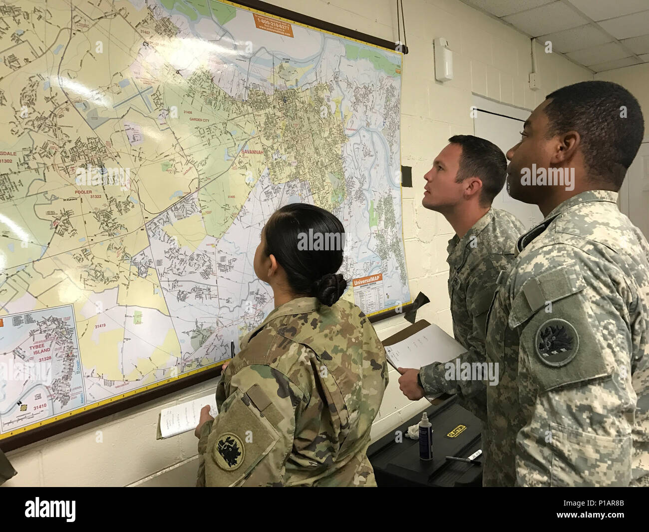 Leadership of the 190th Military Police Company plan a route to traffic ...