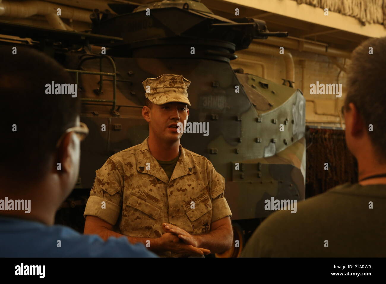U.S. Marine Corps Cpl. Nicholas Figueroa speaks with local San ...