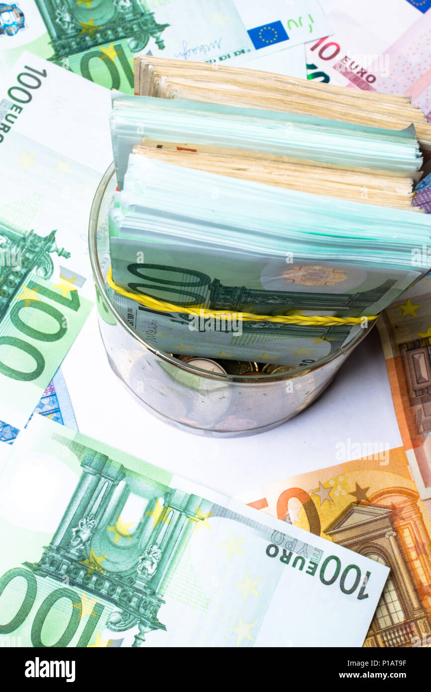 Saving money box with euro banknotes and cents.Banknotes of the ...