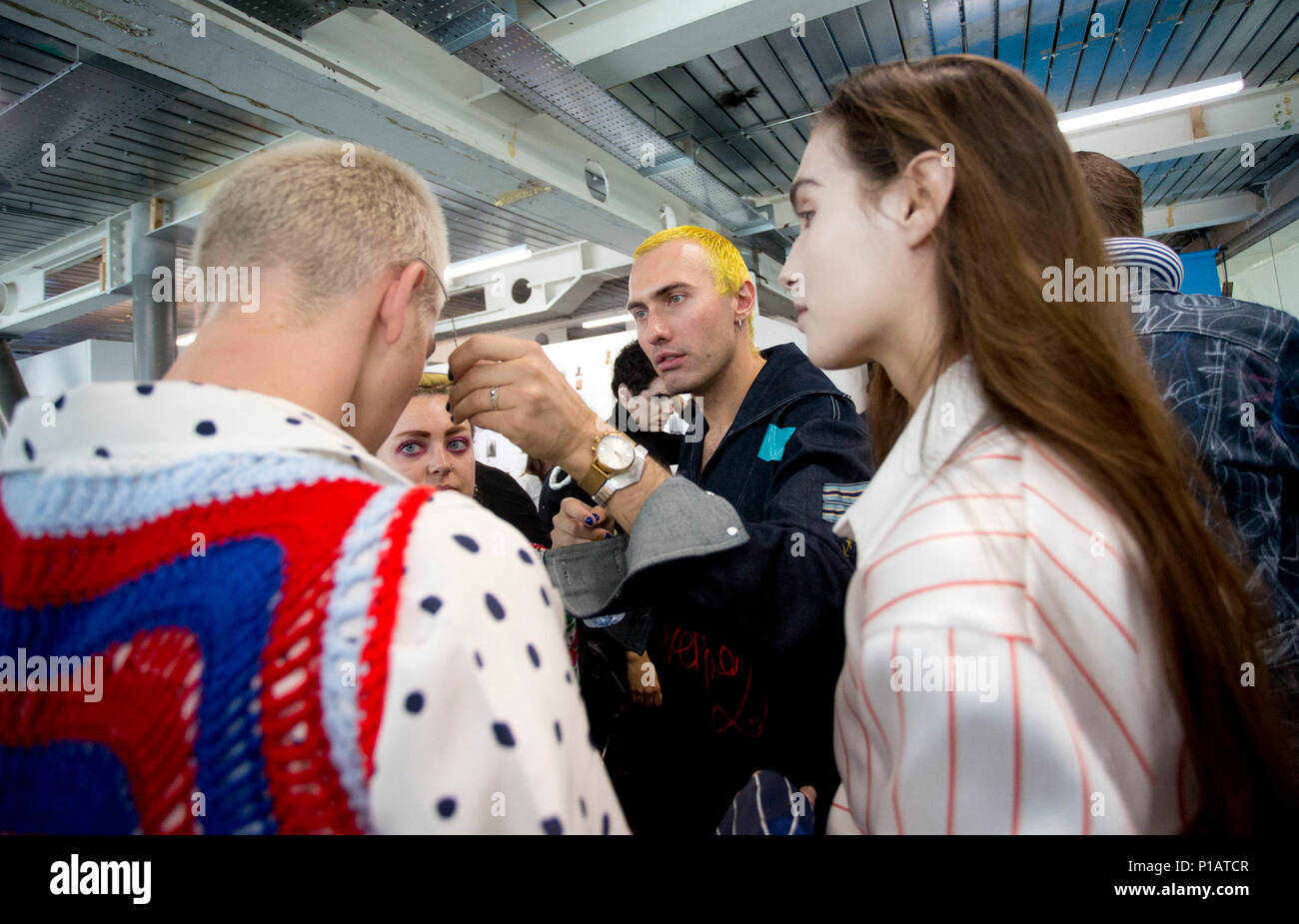 Designer Charles Jeffrey (centre) backstage at his London Fashion Week ...