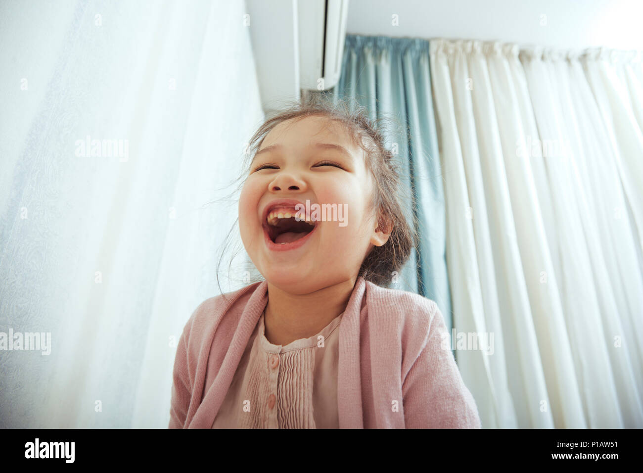Cute, laughing girl Stock Photo - Alamy