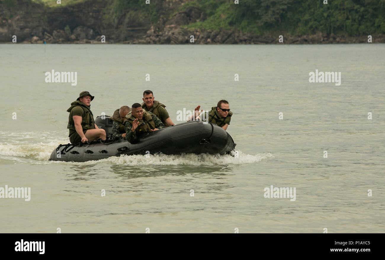 U.S. Marine Brig. Gen. John Jansen rides in a combat rubber raiding ...