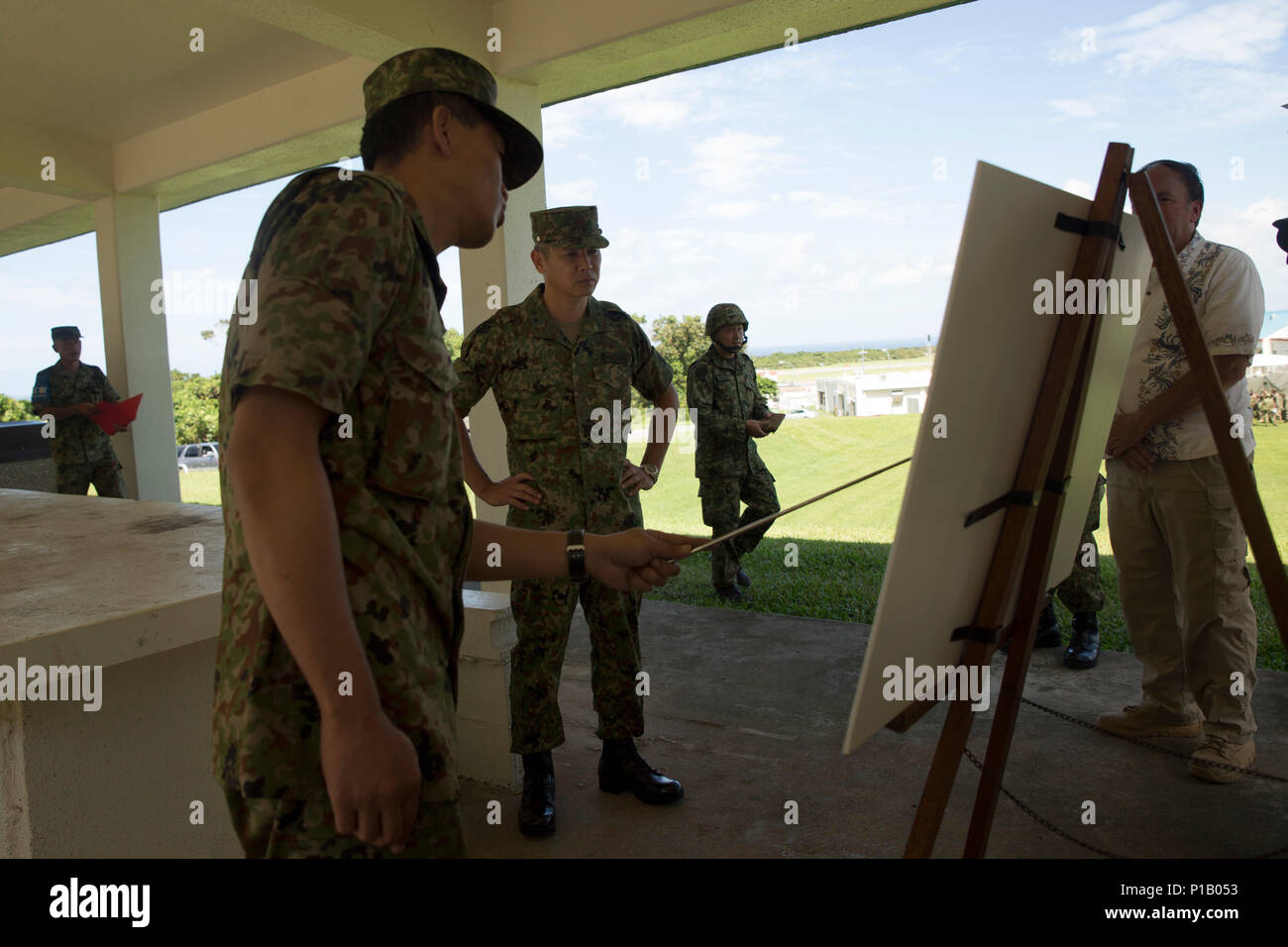 Japan Ground Self-Defense Force Maj. Gen. Tomofusa Hanada receives a ...