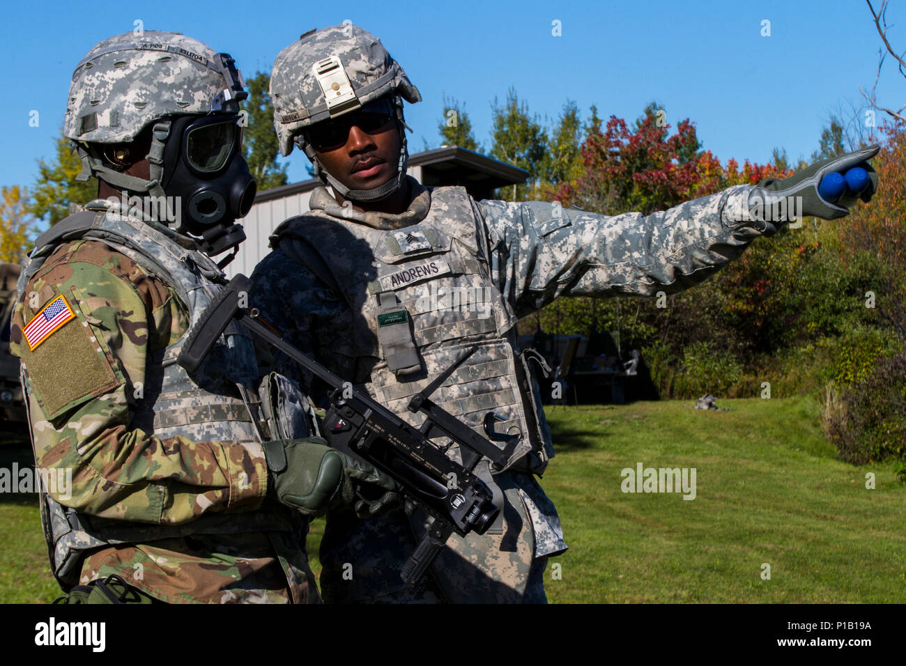 Sgt. Tyriek Andrews instructs Spc. Edward Limo on which targets to fire ...