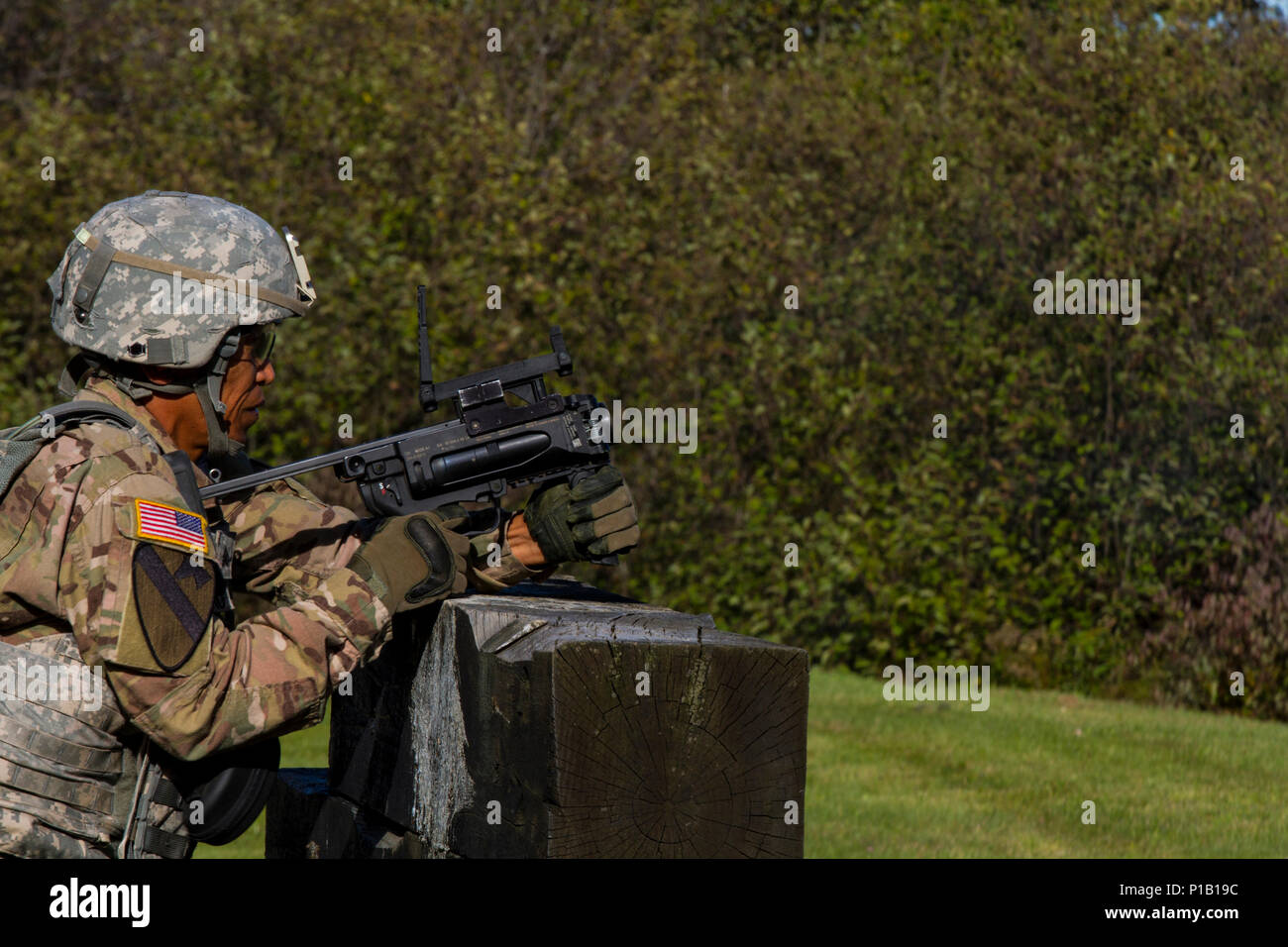 Sgt. Patricio Manzano takes aim during some of the final shots of M320 ...