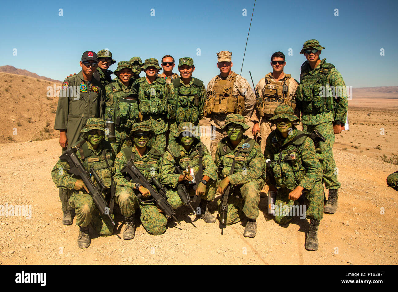 U.S. Marines and Soldiers from the Singapore Armed Forces pose for a ...