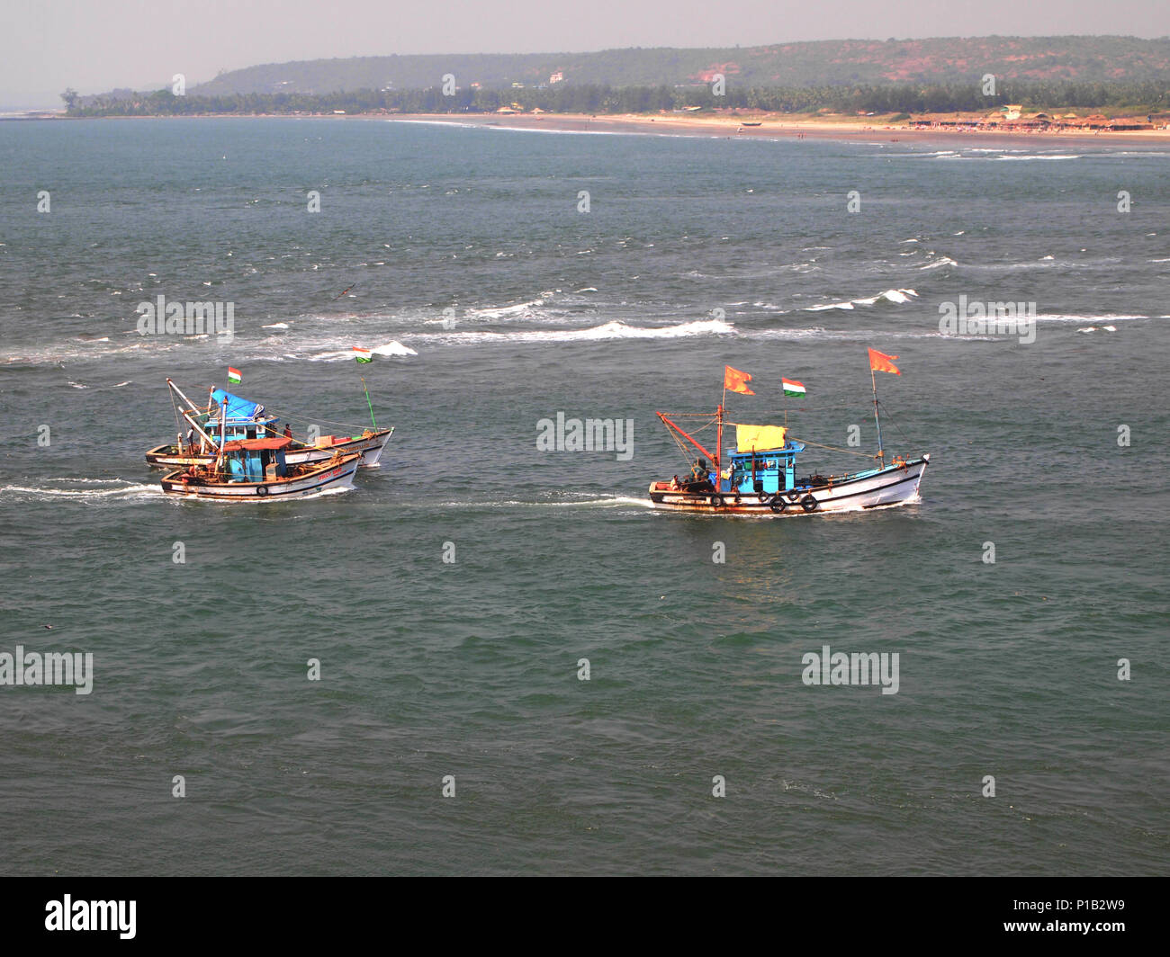 Artisanal fisheries fleet returning to port after a day’s fishing, in ...