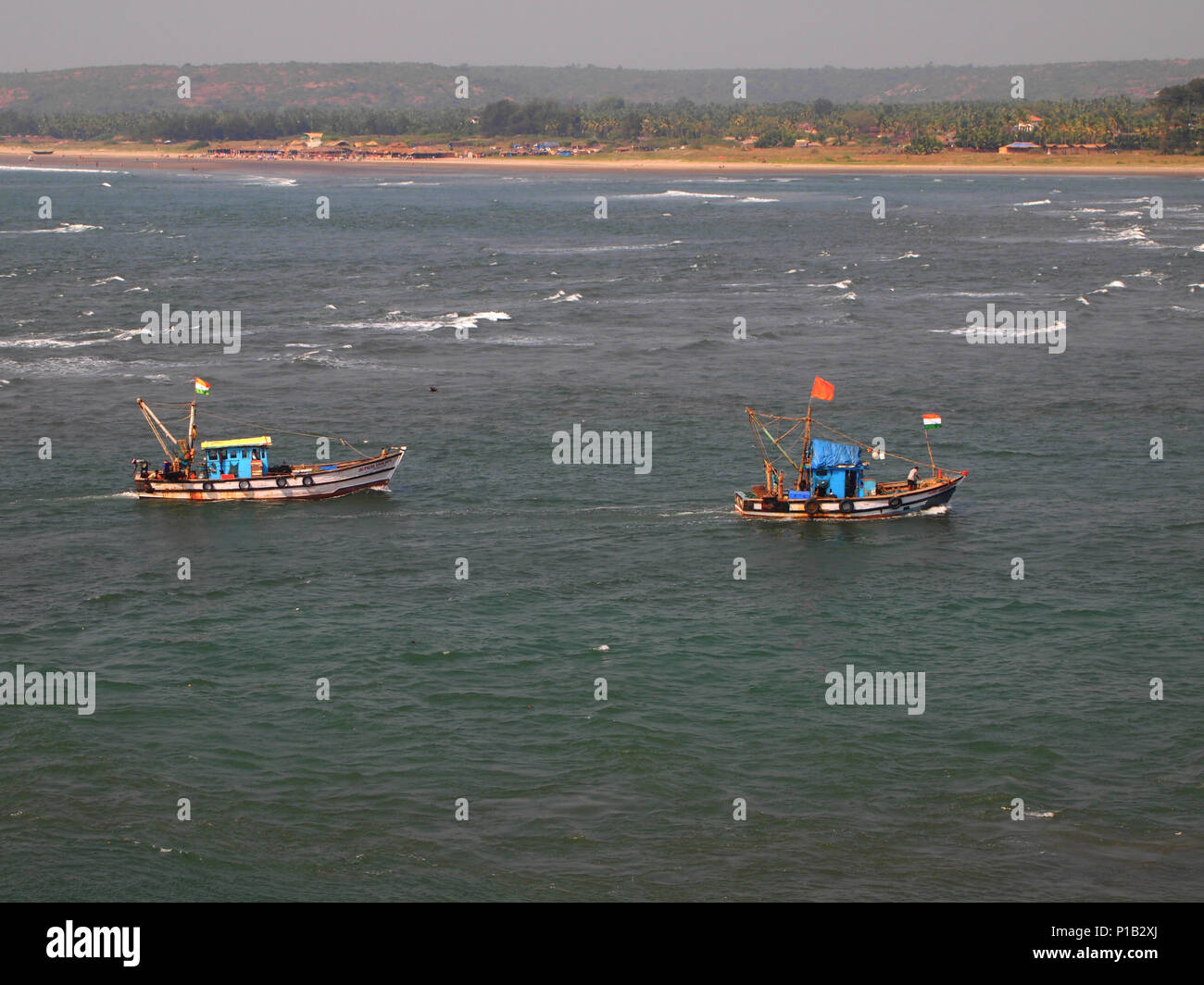 Artisanal fisheries fleet returning to port after a day’s fishing, in ...
