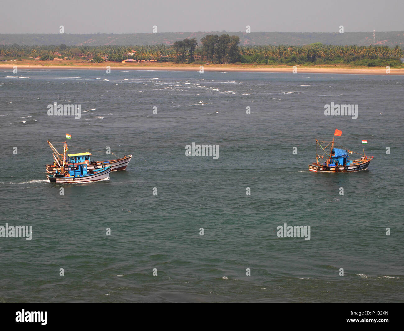 Artisanal fisheries fleet returning to port after a day’s fishing, in ...