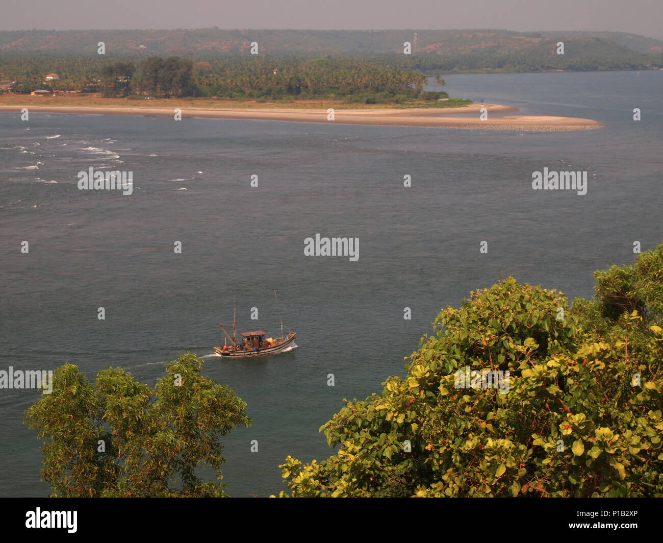 Artisanal fisheries fleet returning to port after a day’s fishing, in ...