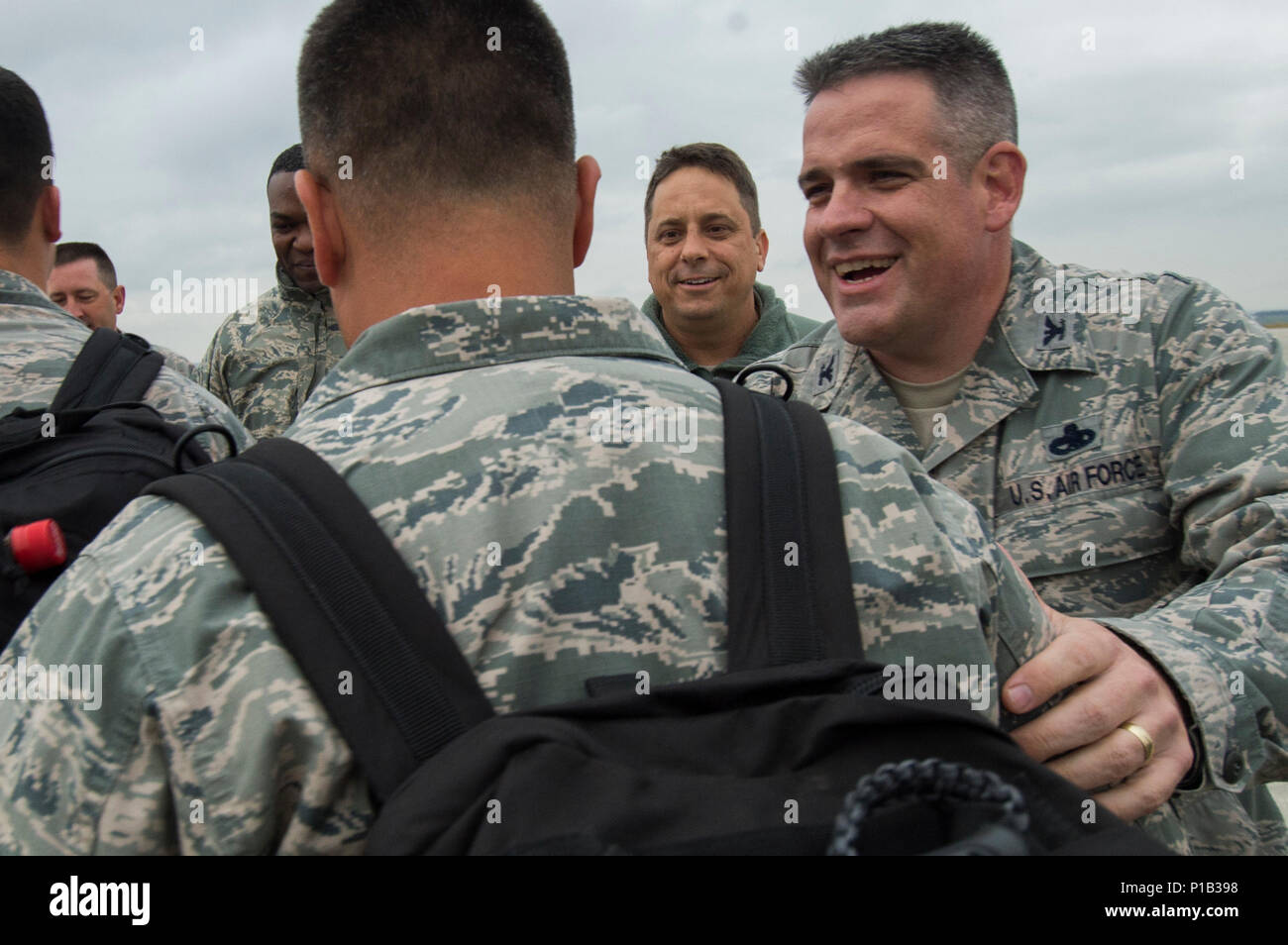 Col. Stephen Scherzer, 52nd Maintenance Group commander, right, greets ...