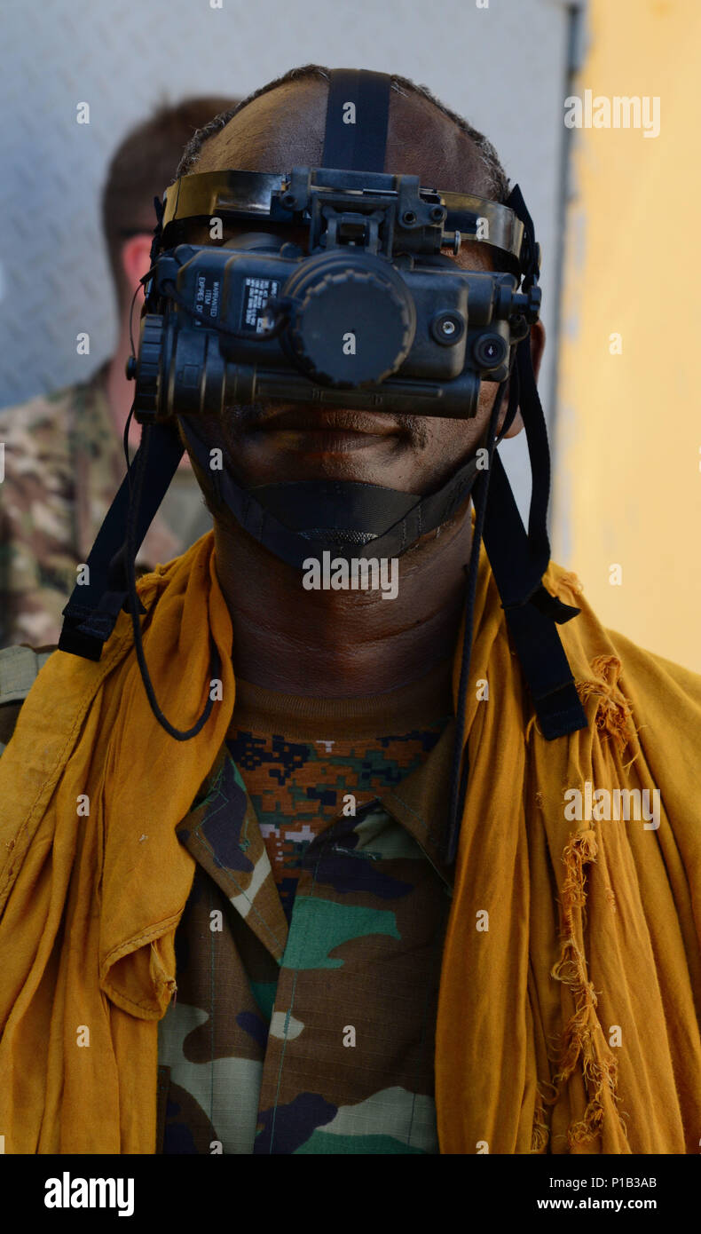 A Djiboutian soldier poses for a photo before taking part in a night ...