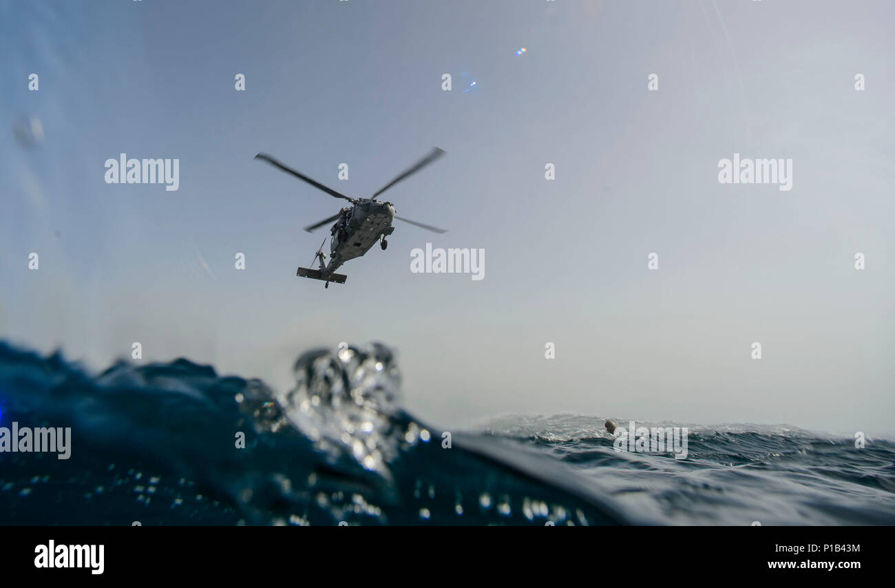 An explosive ordnance disposal technician, assigned to Commander, Task ...