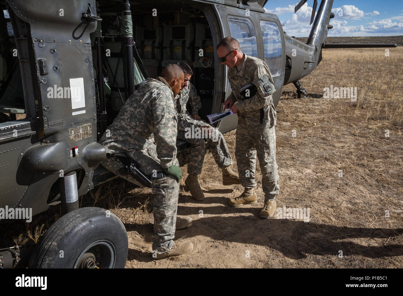 U.S. Army UH-60 Black Hawk helicopter crew chiefs assigned to 2-158th ...