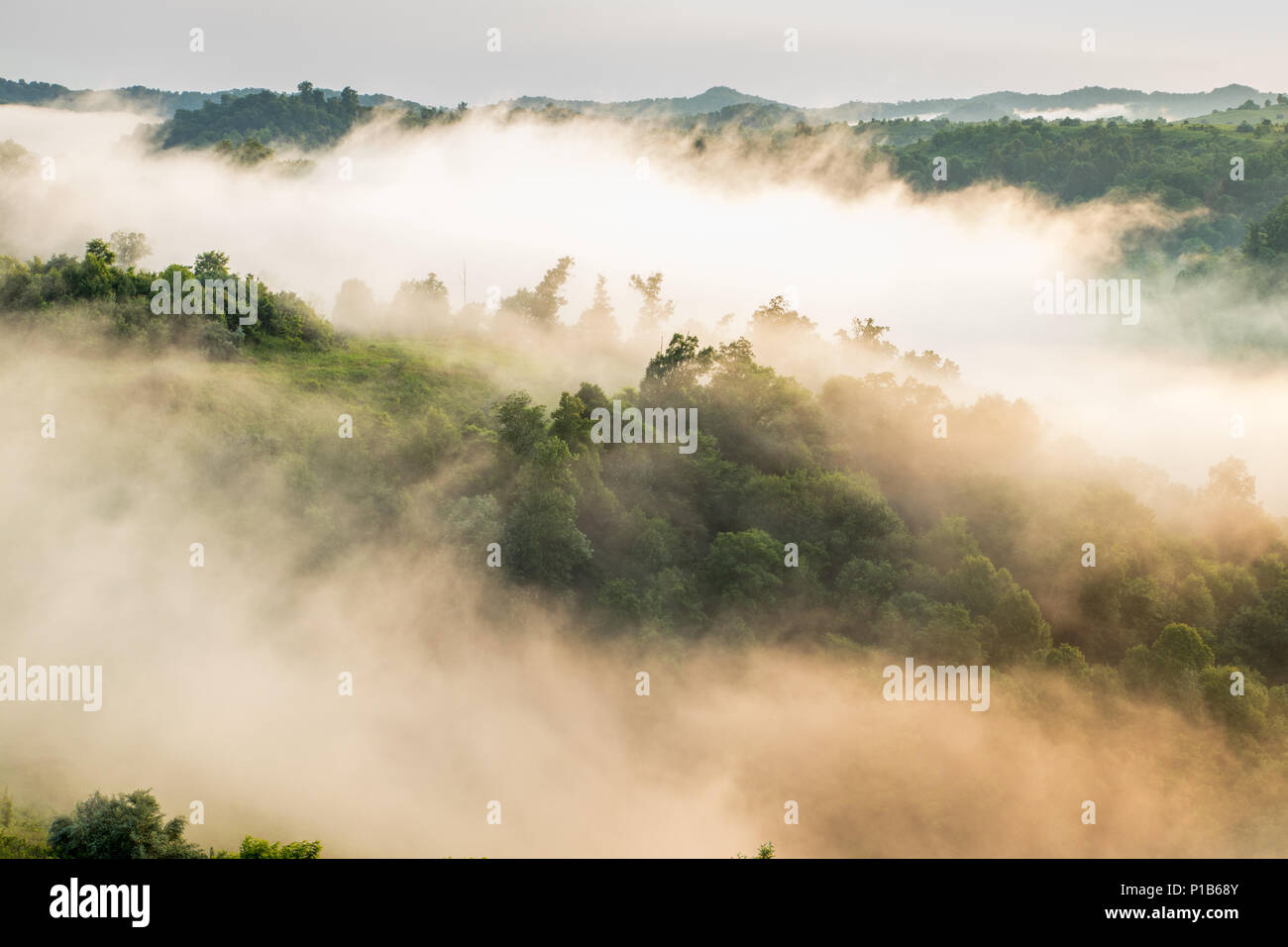 Sunrise over thick fog sunset hi-res stock photography and images - Alamy