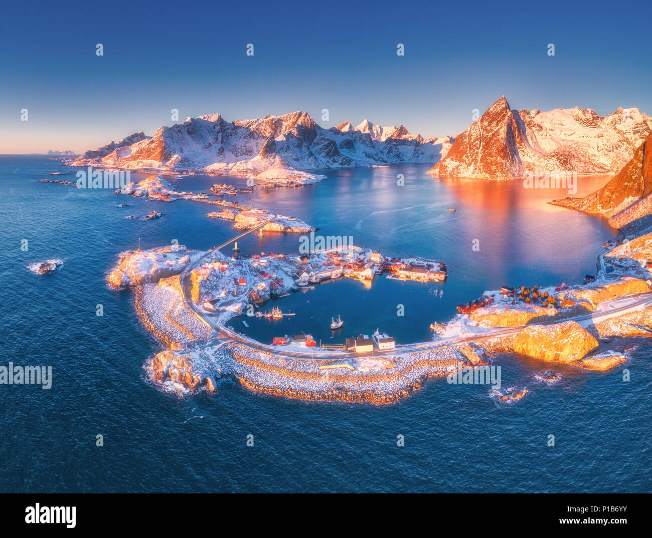 Aerial view of Reine and Hamnoy at sunset in winter. Amazing Lofoten islands, Norway. Panoramic ...