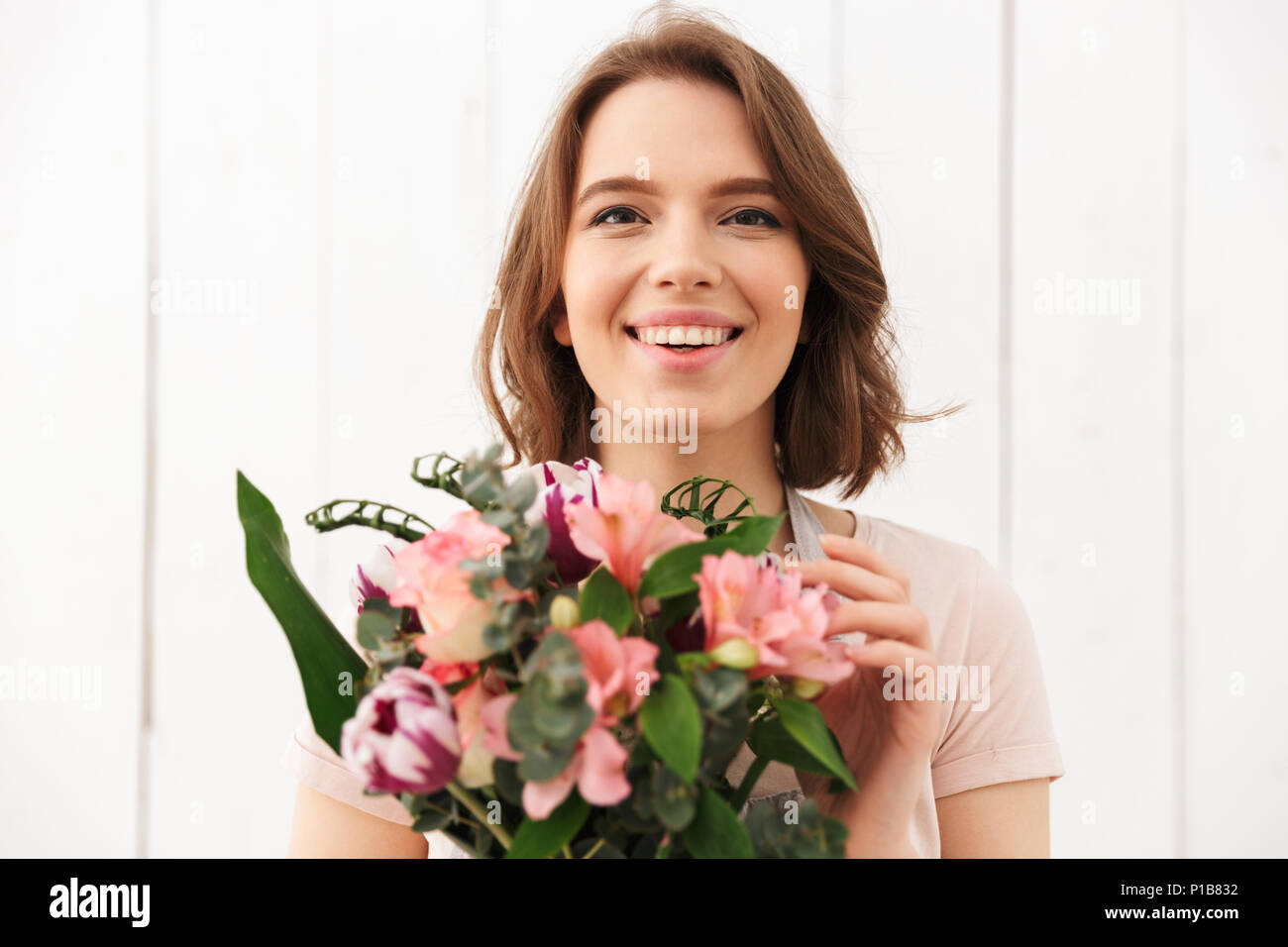 Cheerful florist woman sell flowers hi-res stock photography and images ...