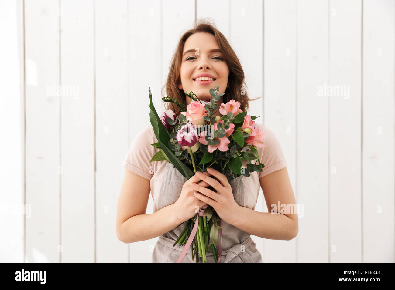 Cheerful florist woman sell flowers hi-res stock photography and images ...