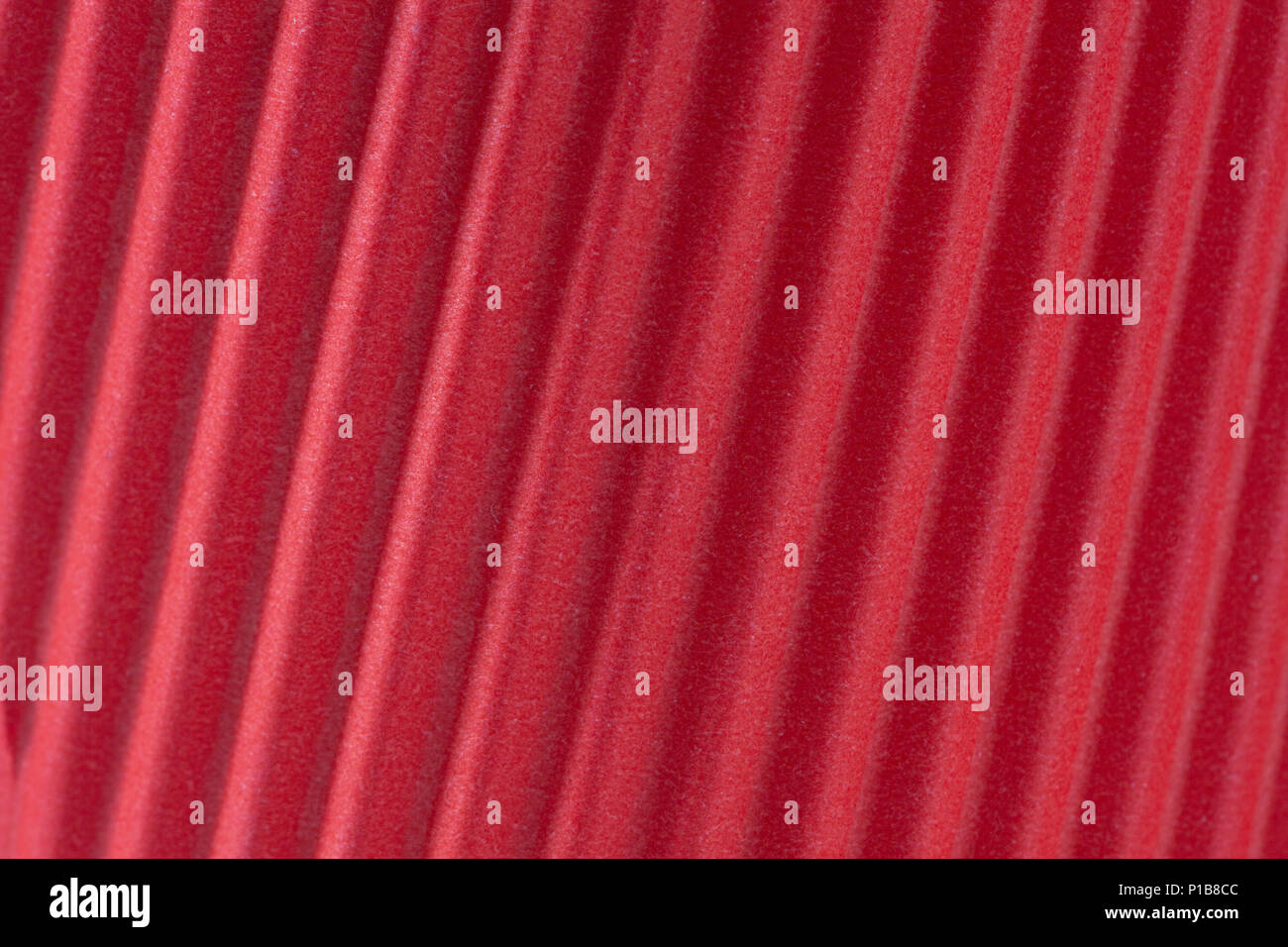 Red corrugated paper background texture closeup Stock Photo - Alamy