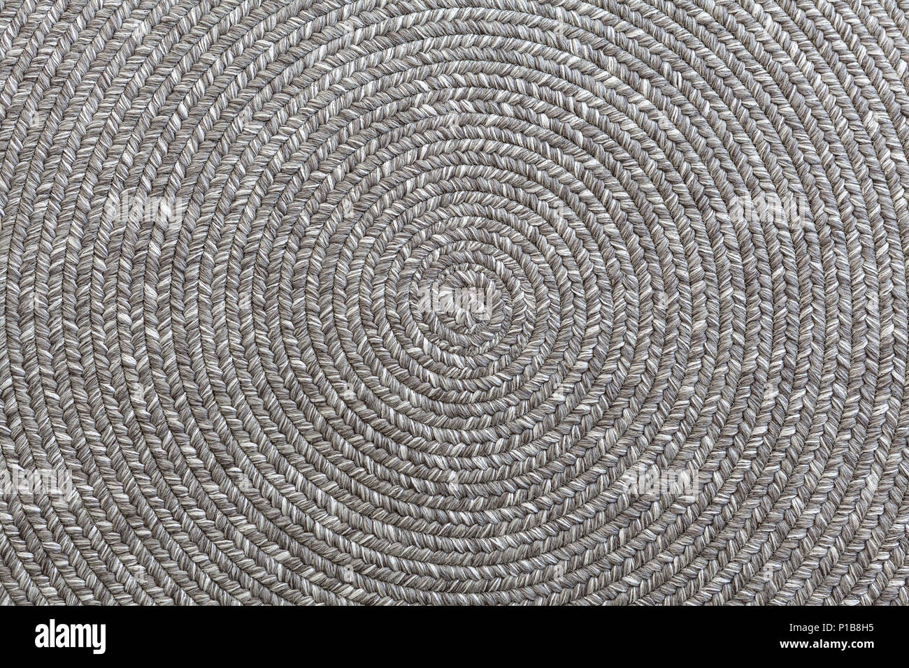 Jute braided home spiral rug background texture pattern Stock Photo - Alamy