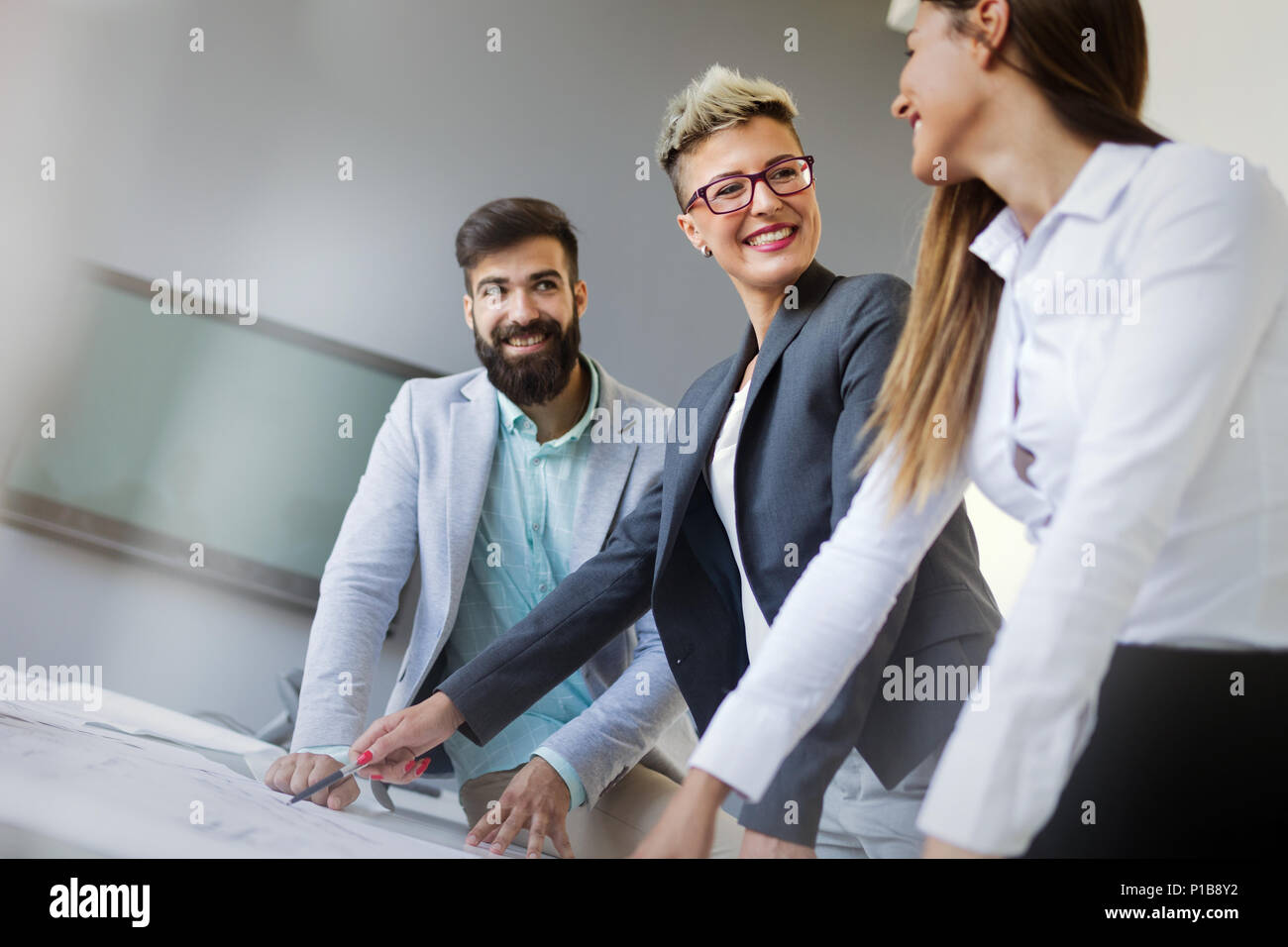 Group of business people collaborating in office Stock Photo - Alamy
