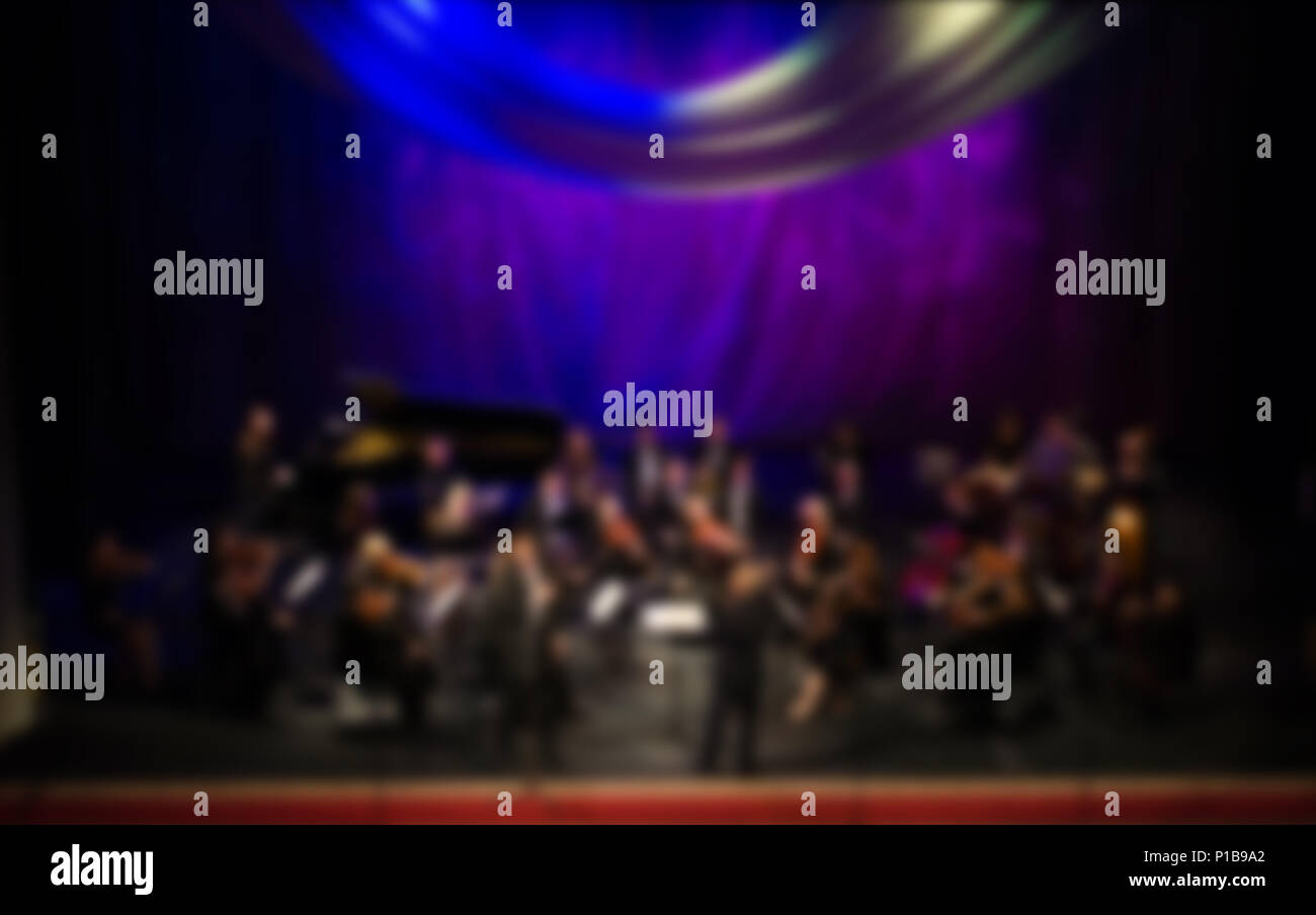 Artists symphony orchestra. abstract blurred image. Musician plays a ...