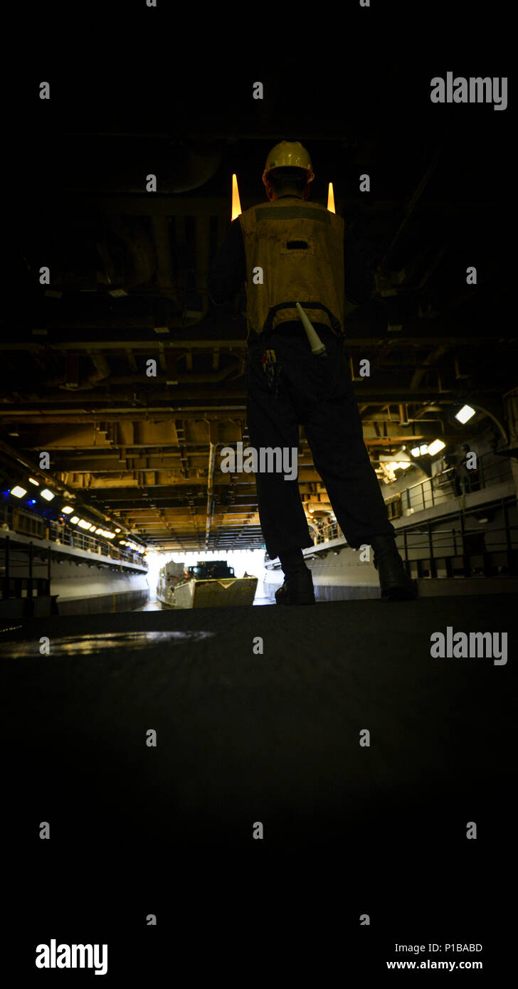 NORFOLK (Oct. 8, 2016) – Petty Officer 3rd Class Jeremy Ducker guides ...