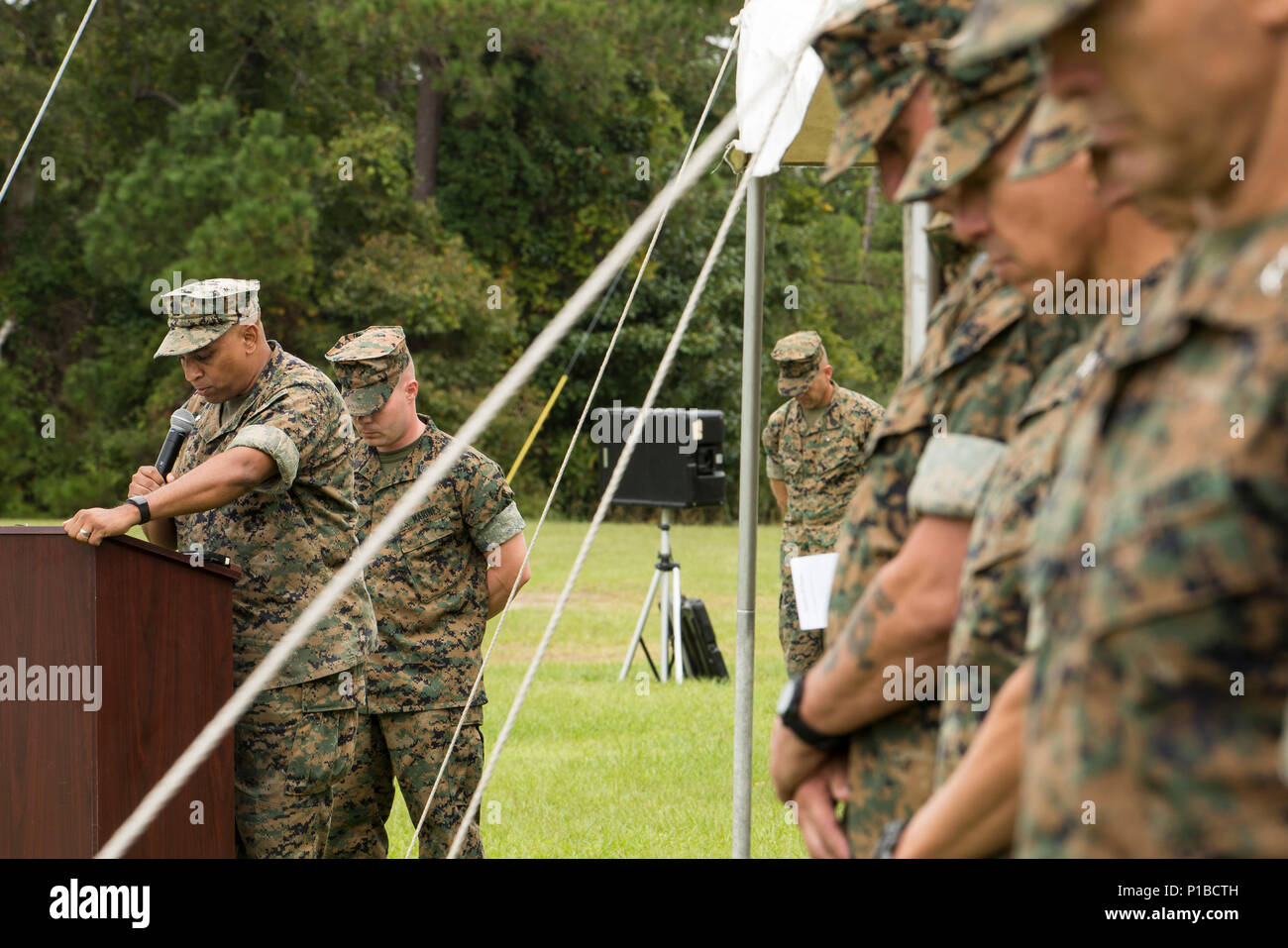 U.S. Navy Cmdr. John R. Logan, left, chaplain, 6th Marine Regiment, 2nd ...