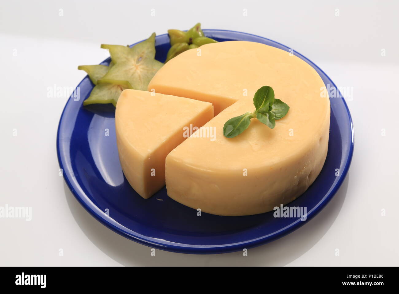 A sliced cheese wheel, closeup Stock Photo - Alamy