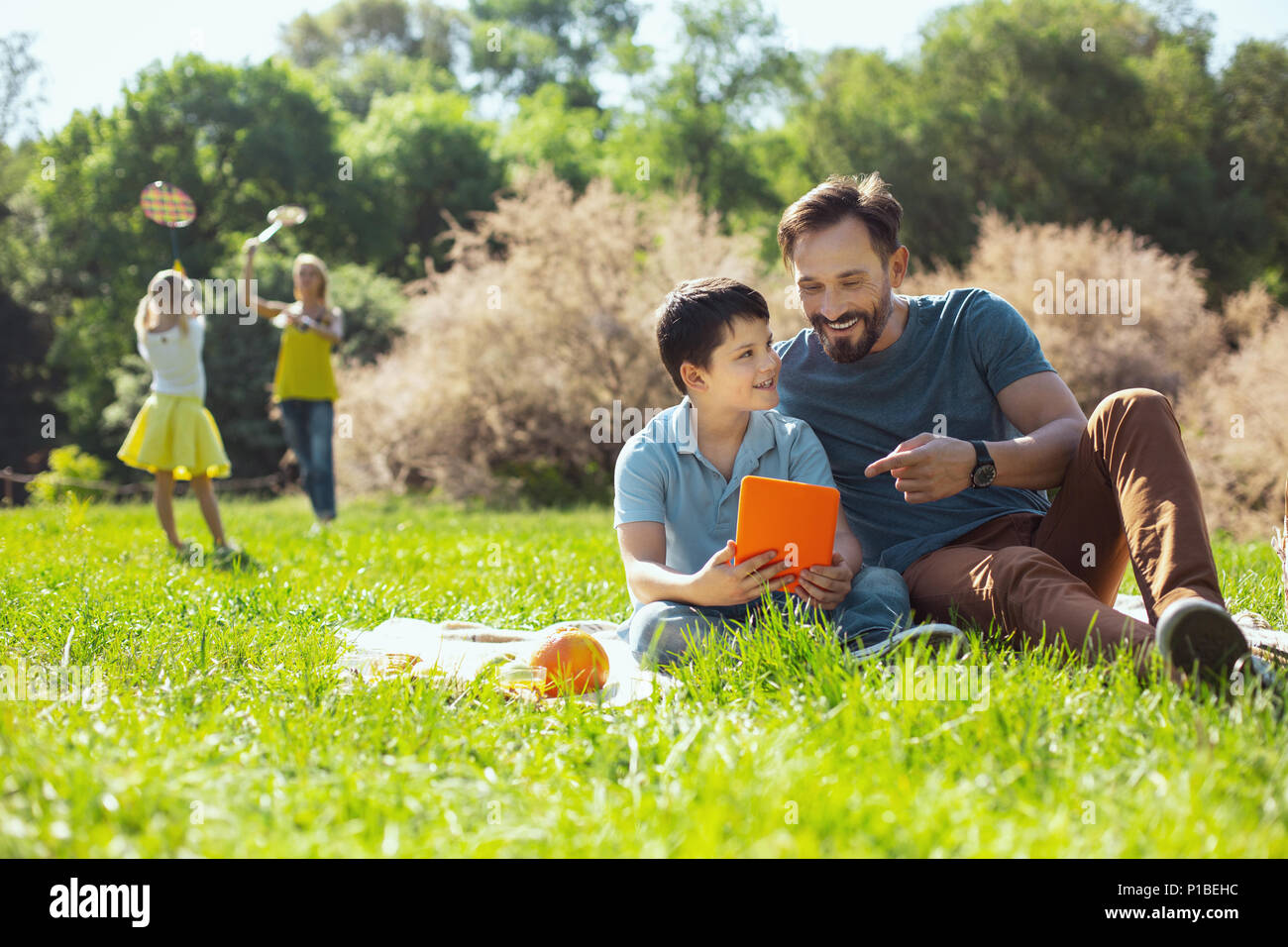Content parents entertaining their kids Stock Photo - Alamy