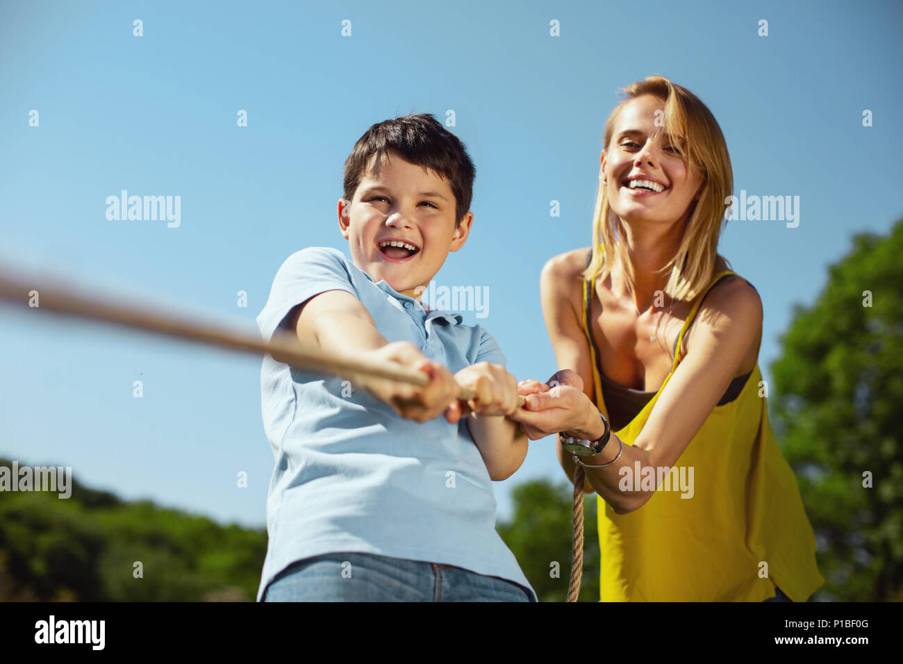 Child pulling rope hi-res stock photography and images - Alamy