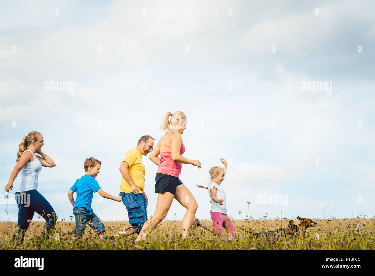 Family running for better fitness in summer Stock Photo - Alamy