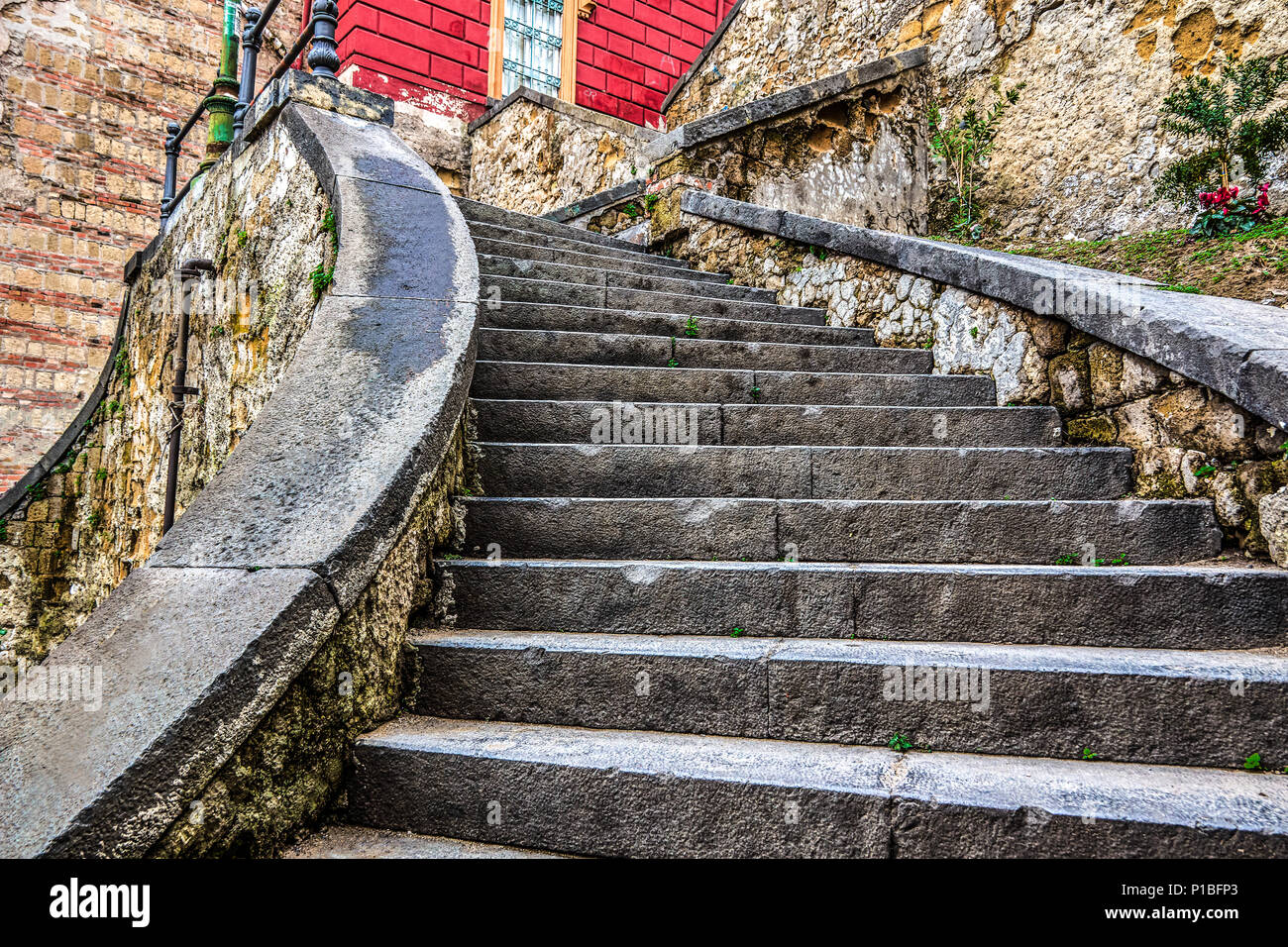 Dark grey stair steps made of granite. Ancient Roman stone stairs in ...