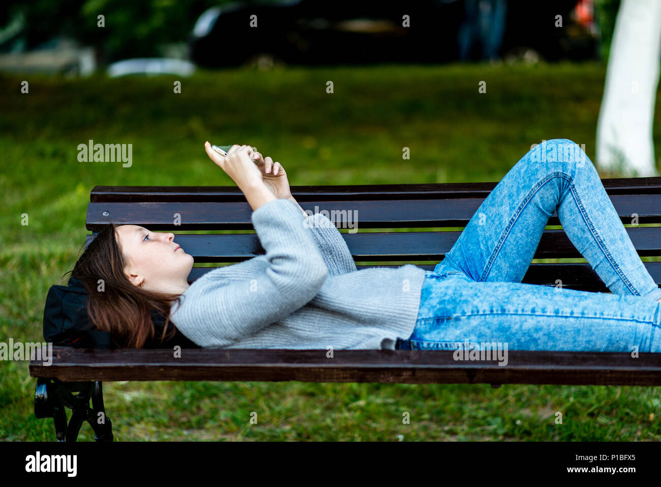Girl Lying On Park Bench Stock Photos & Girl Lying On Park Bench Stock ...