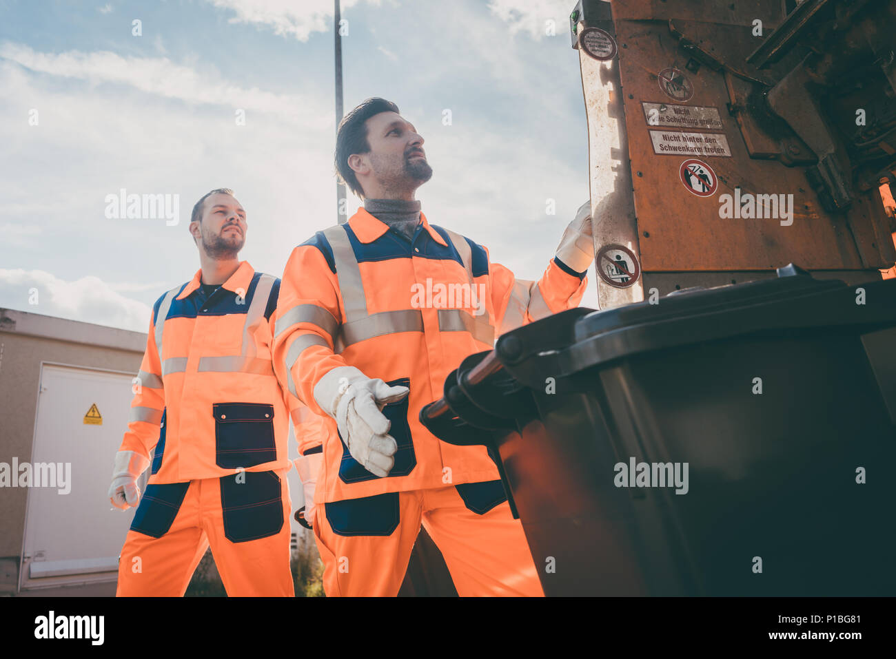 Man cleaning dustbins hi-res stock photography and images - Alamy