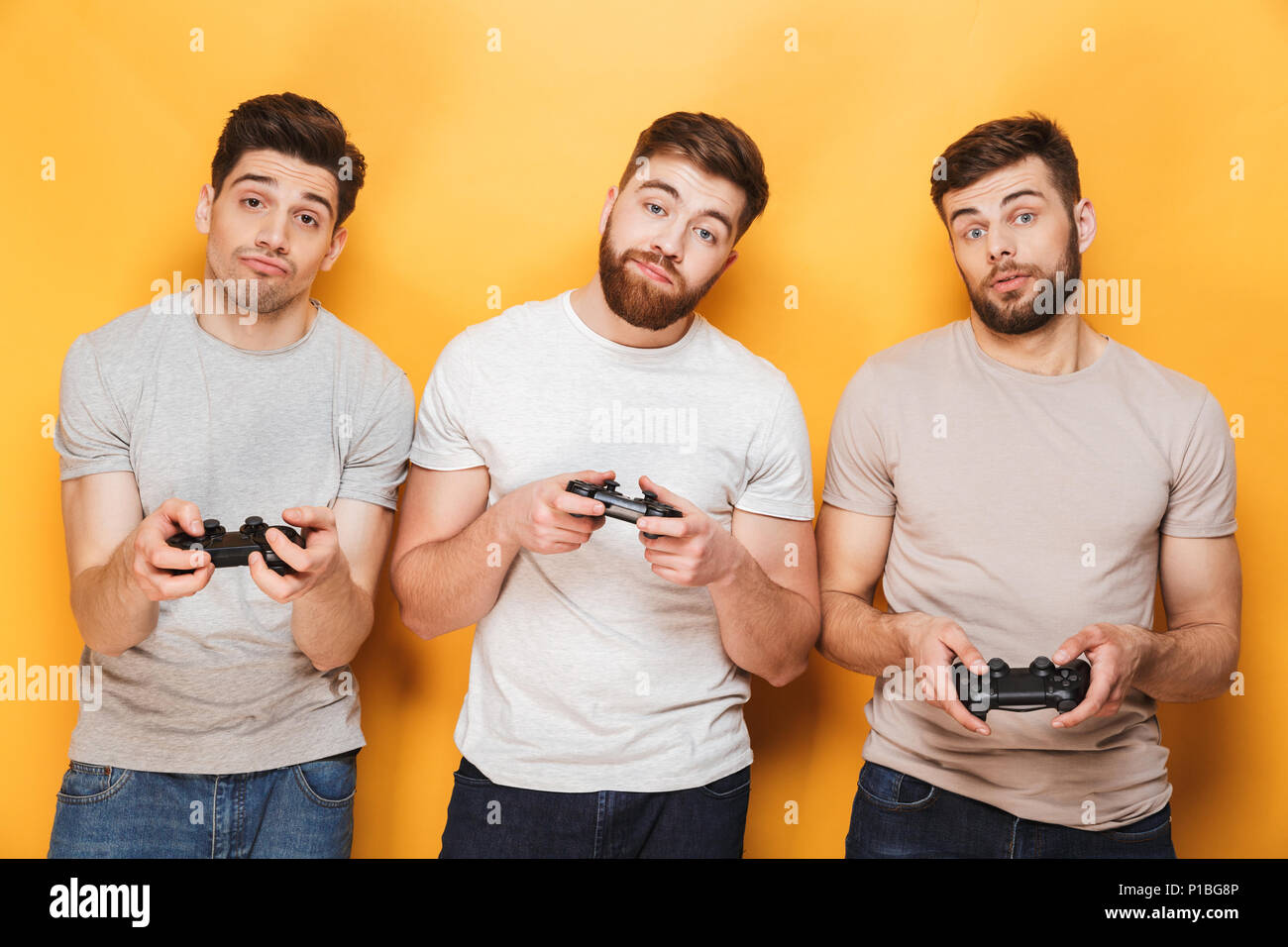 Image of confused young group of men friends standing isolated over ...