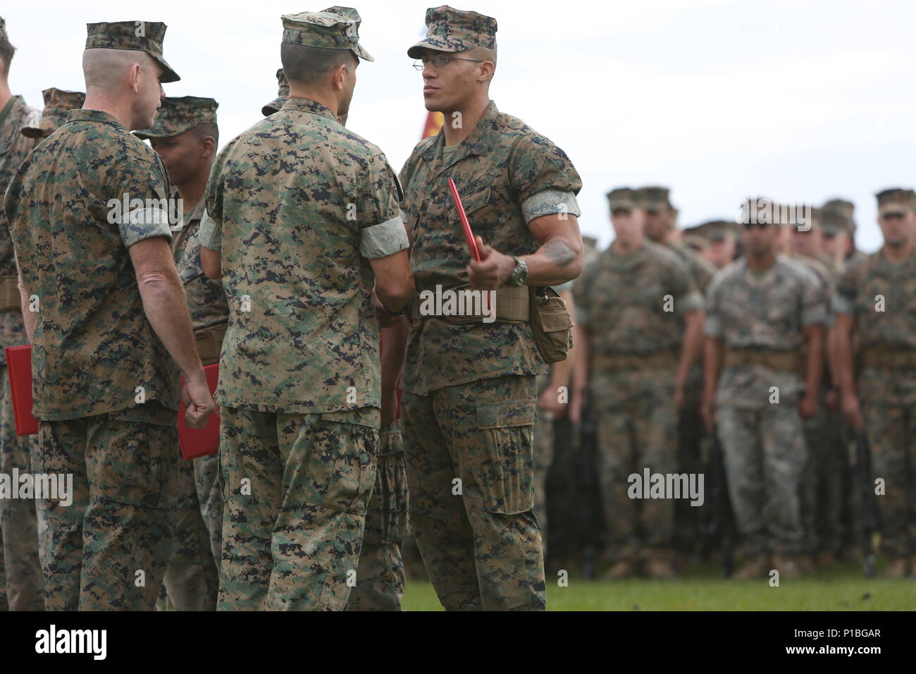U.S. Marine Corps Lt. Col. Justin J. Ansel Jr., center, commanding ...
