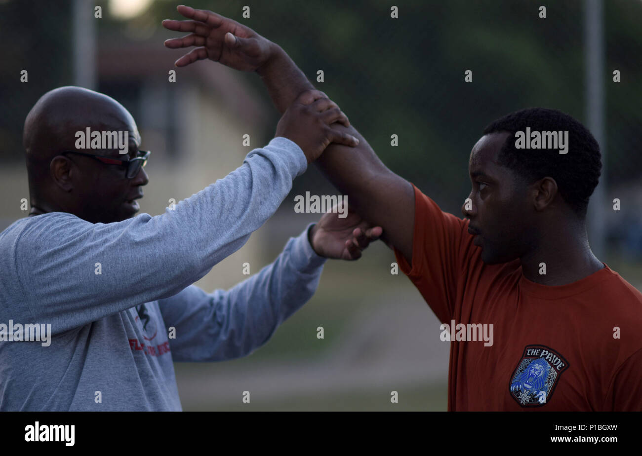 Retired Master Sgt. “E”, helps Airman 1st Class Daryl Parker, 608th Air ...