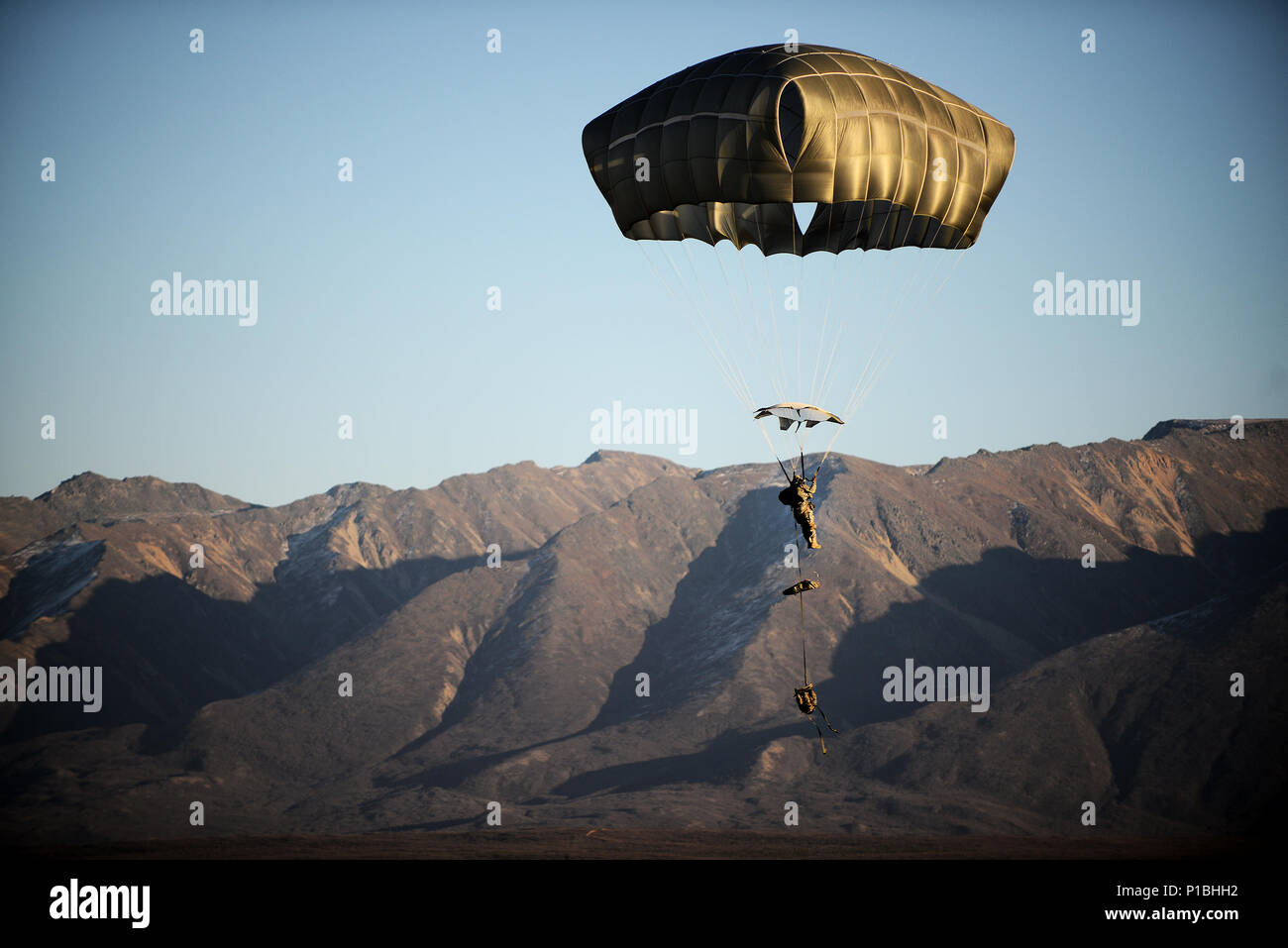 After just under a 60-second decent, a U.S. Army paratrooper parachutes ...