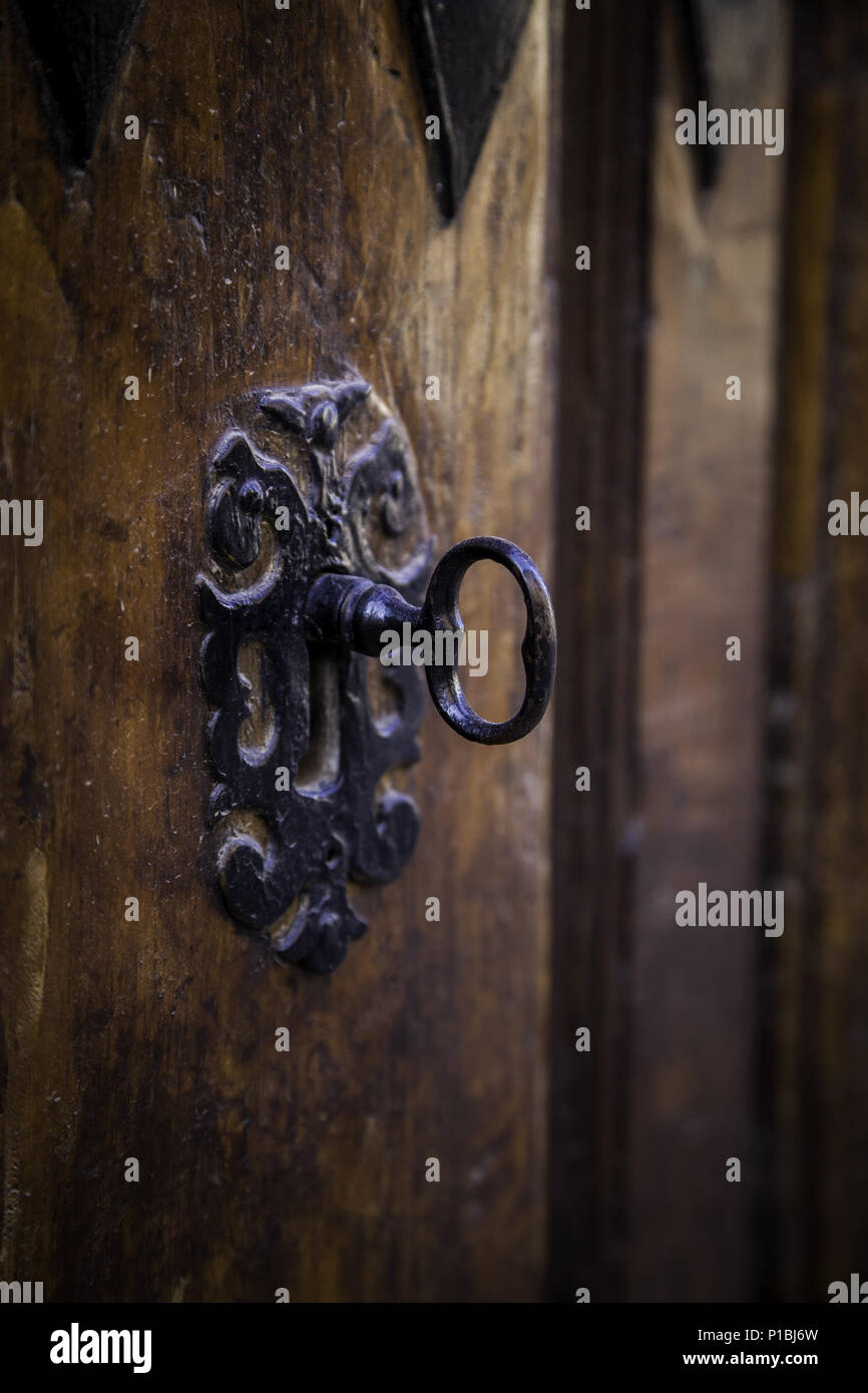 Old key in lock, detail of security lock Stock Photo - Alamy