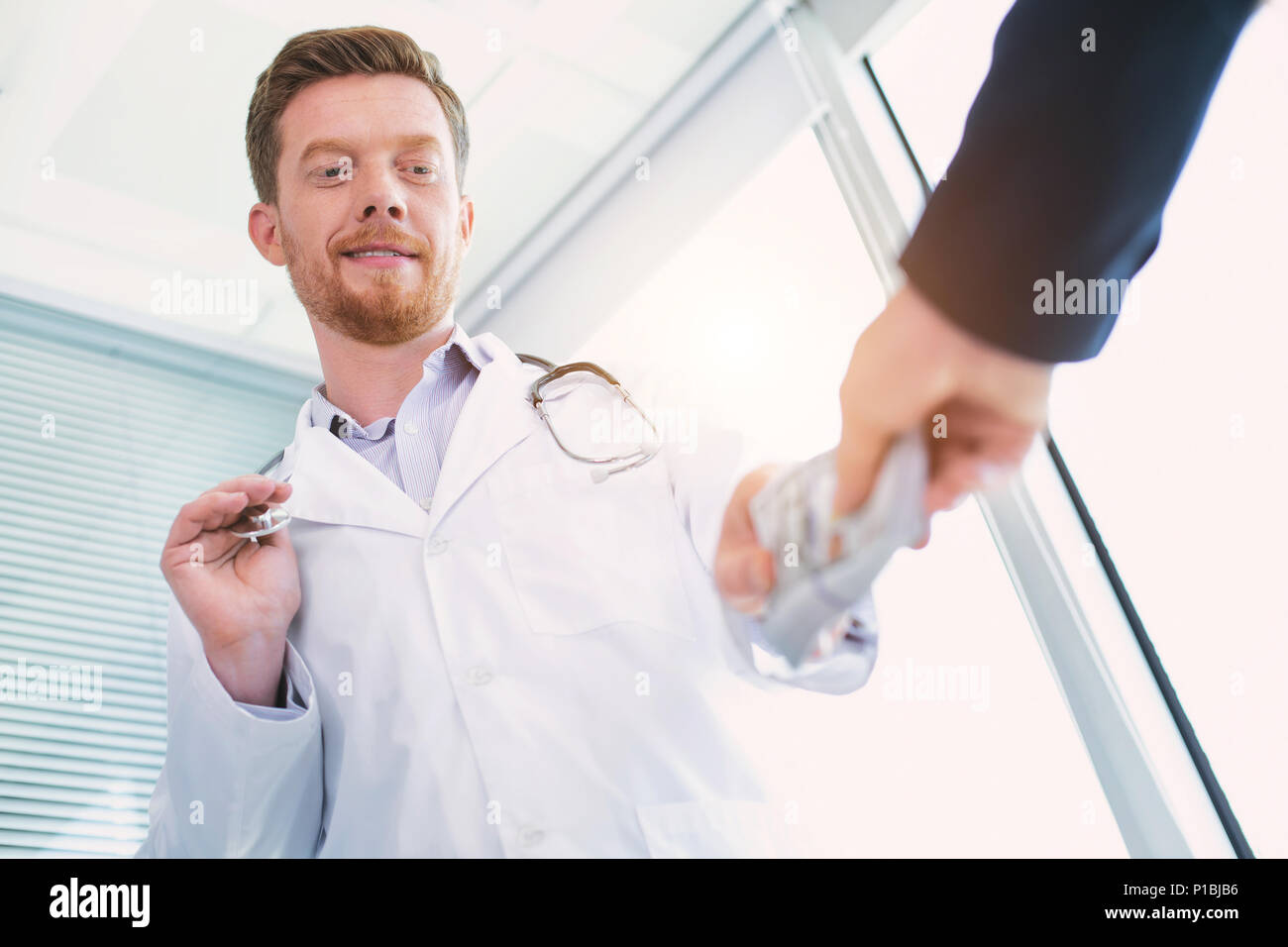 Bribe doctor hi-res stock photography and images - Alamy