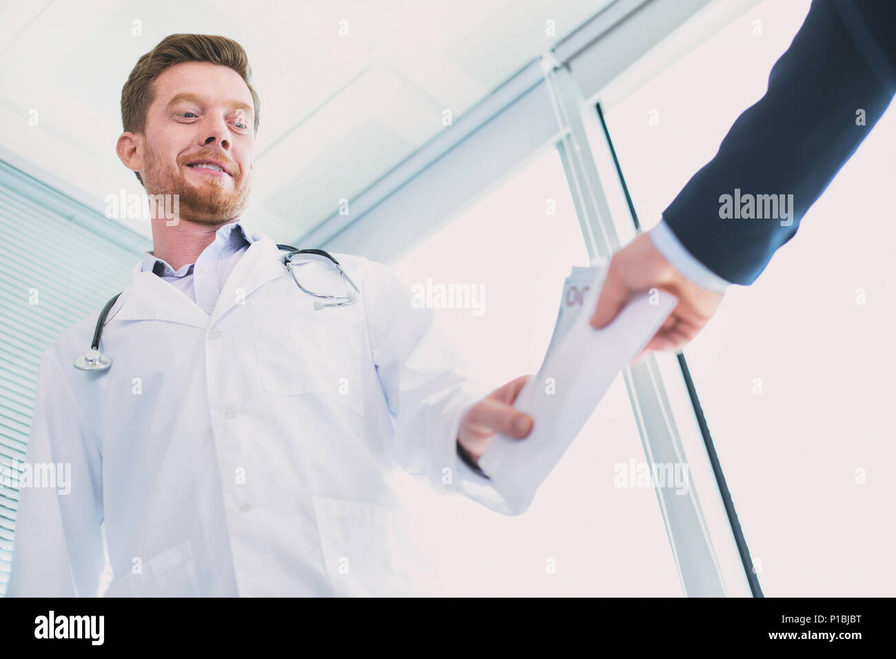 Bribe doctor hi-res stock photography and images - Alamy