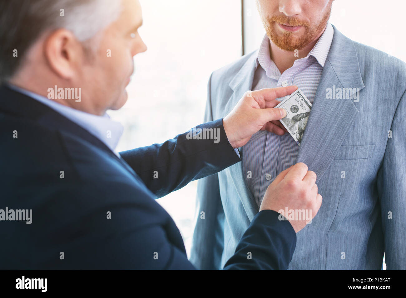 Giving a bribe hi-res stock photography and images - Alamy