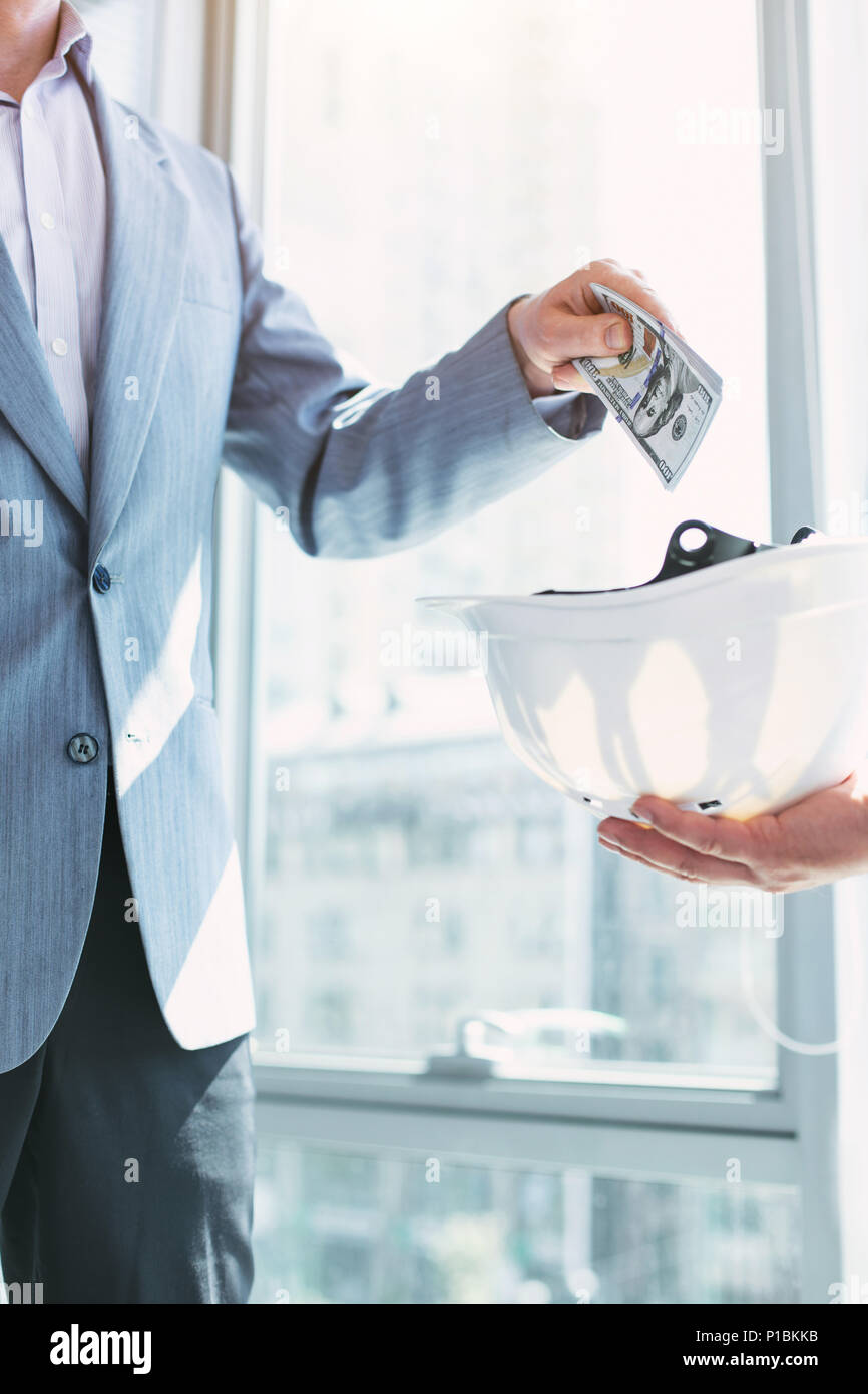 Successful businessman giving bribe hi-res stock photography and images ...