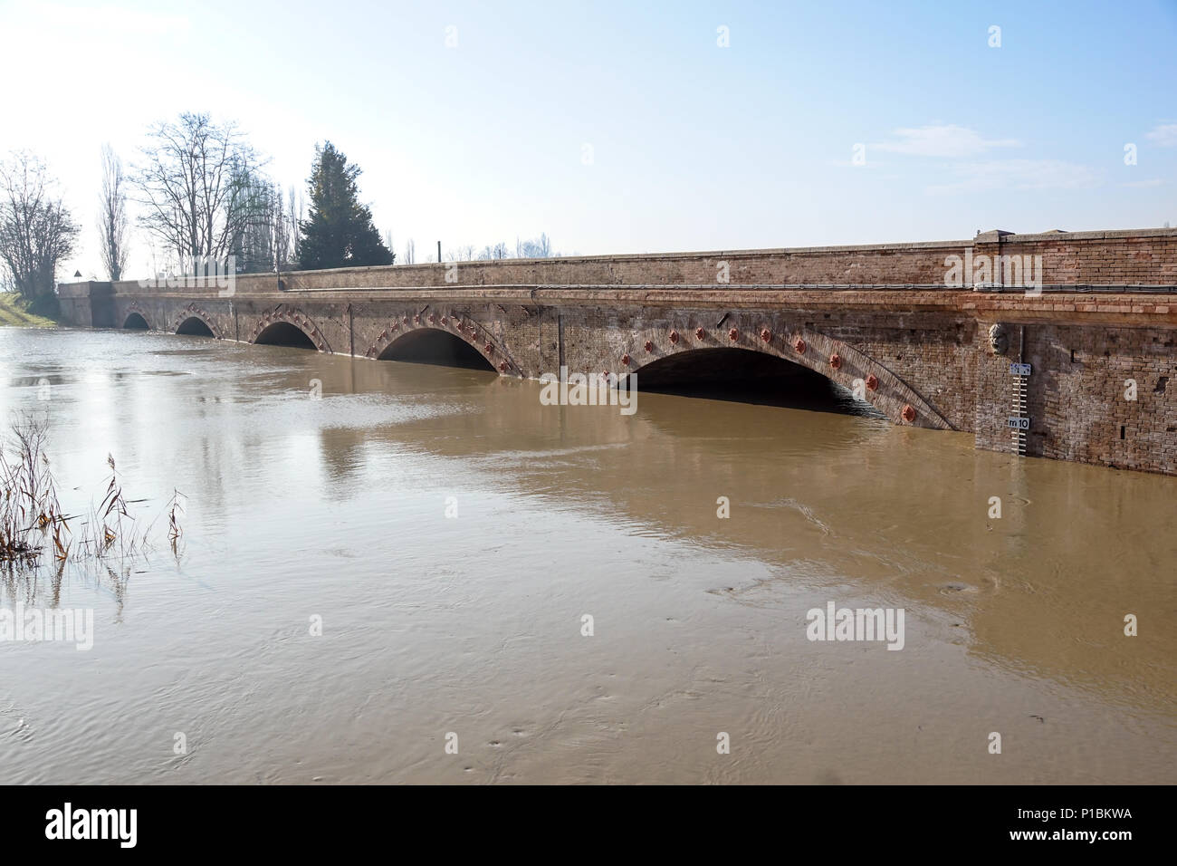 bridge with full river . River is full . Bridge to cross the river that ...