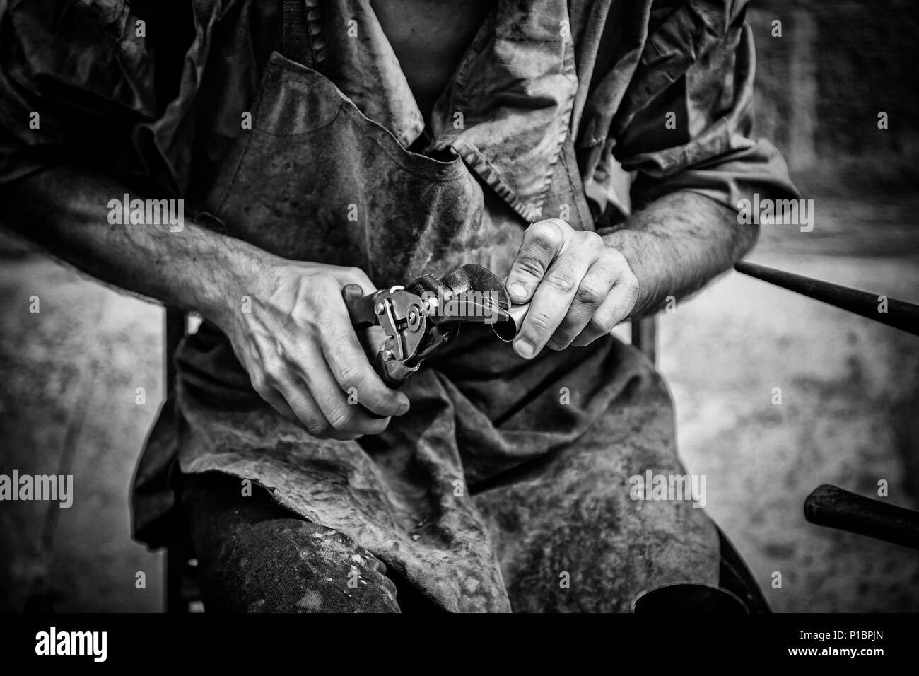 Worker metal craftsman, an artisan detail, tradition and old work Stock ...