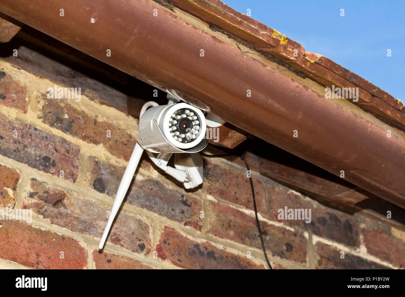 CCTV camera on outside of house, East Sussex, UK Stock Photo - Alamy