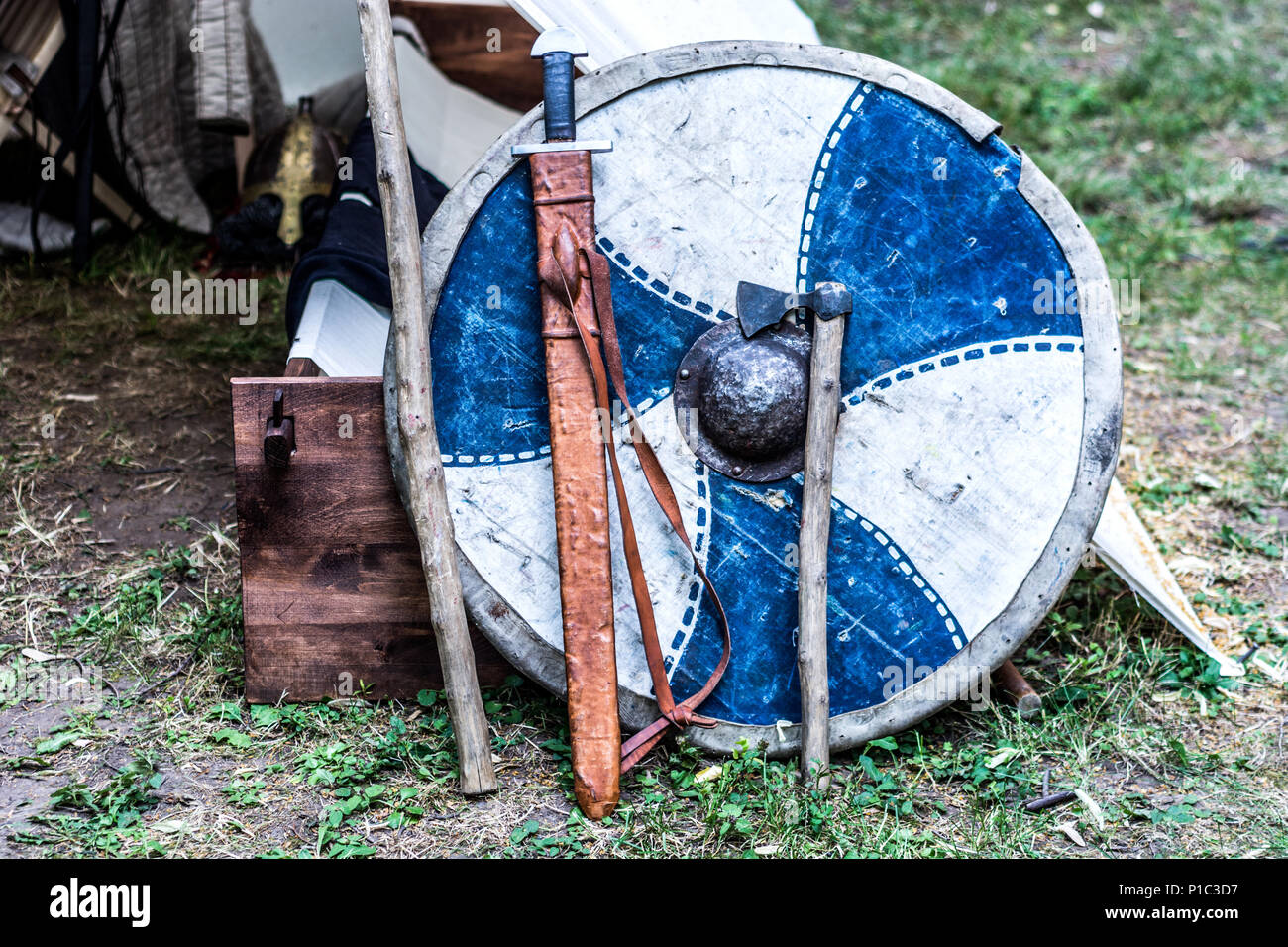 Knight shield, sword and ax in front of the tent. Medieval knight ...
