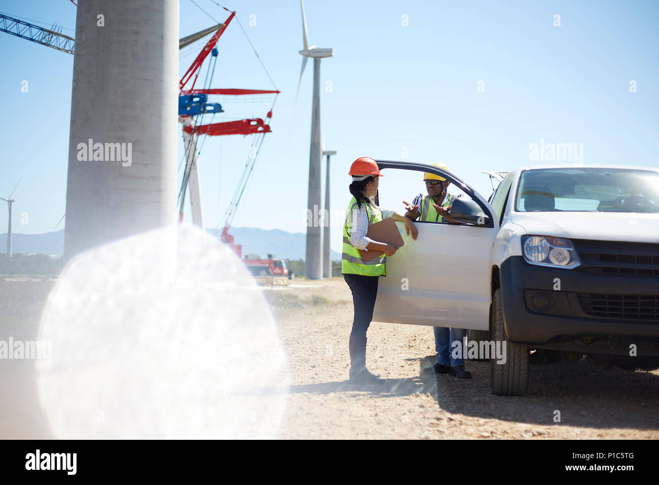 Workers talking at truck at power plant Stock Photo - Alamy