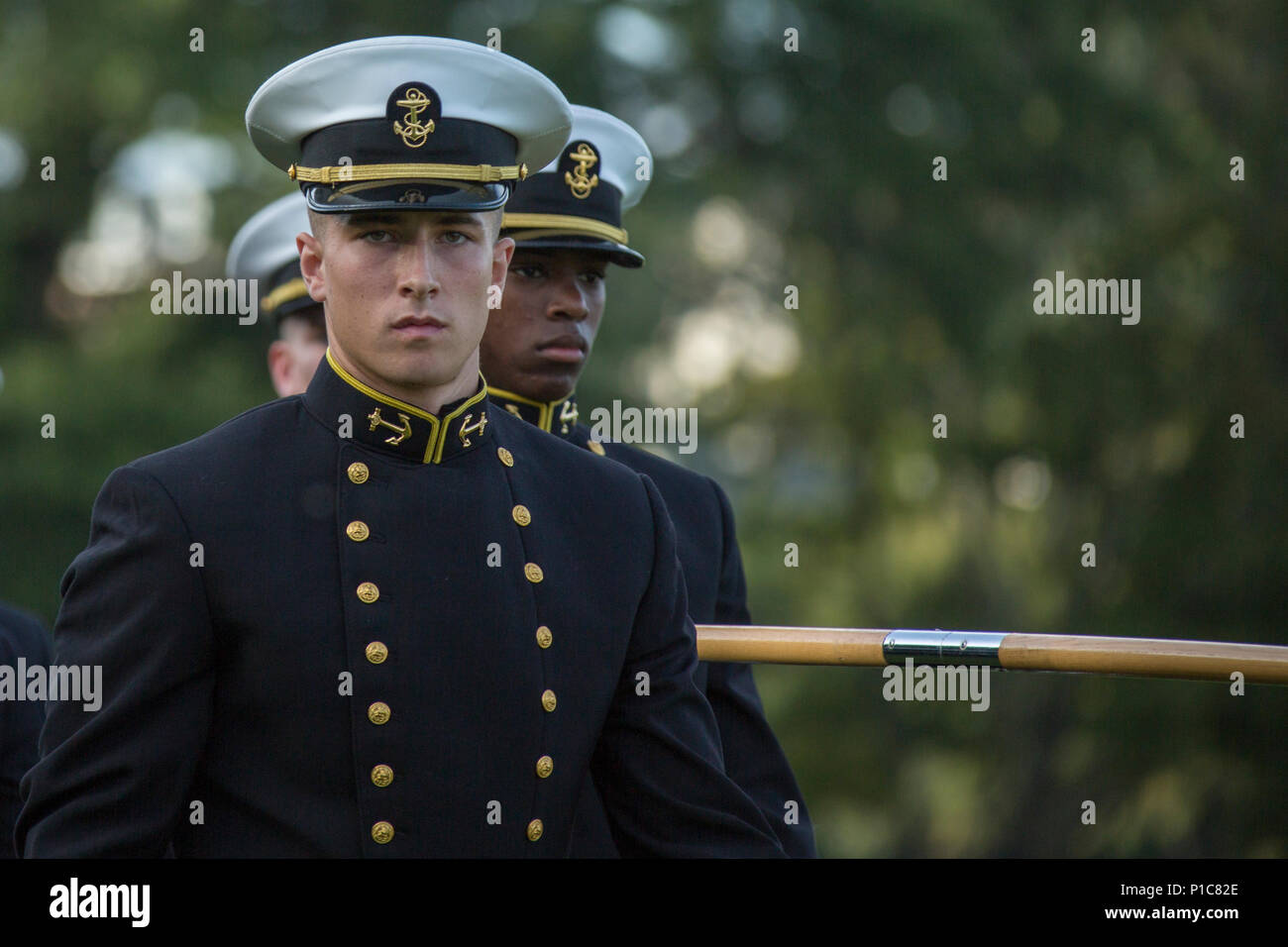 A Midshipman with the U.S. Naval Academy (USNA) marches during the ...